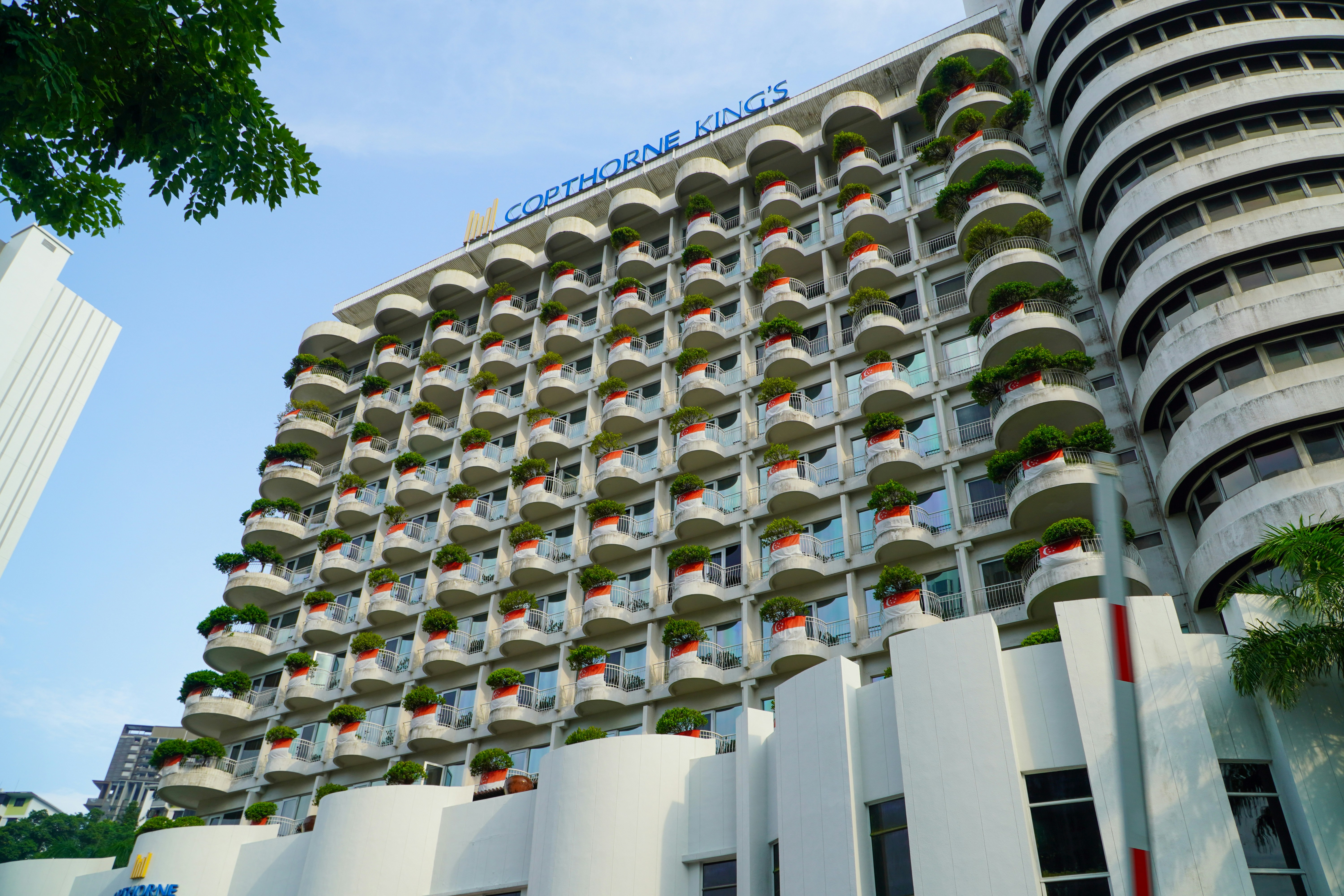 Balcony Forest: A High-Raced Facade of Repeating Pods Against a Clear Sky