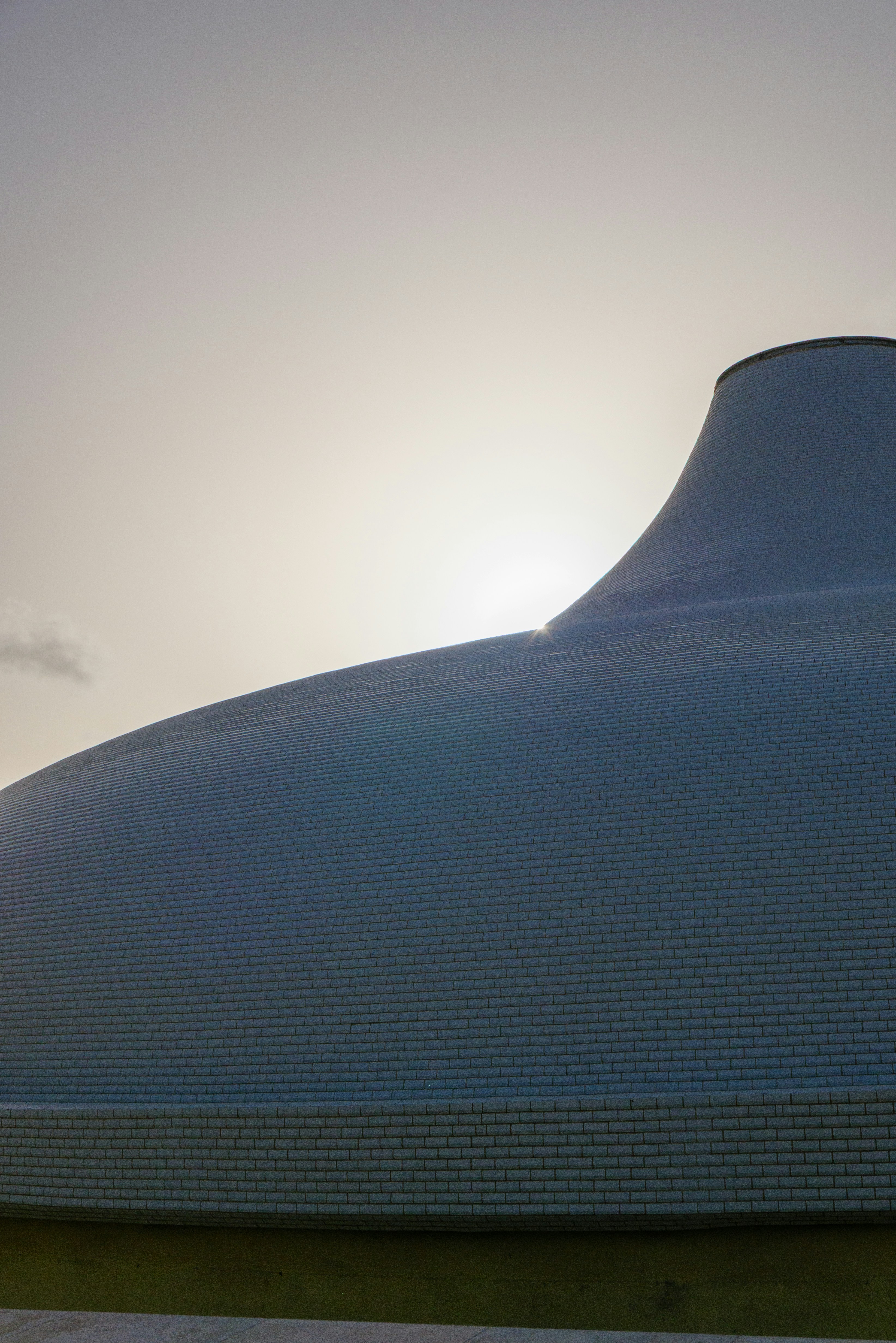 Curved Blue Dome Under Soft Sunrise