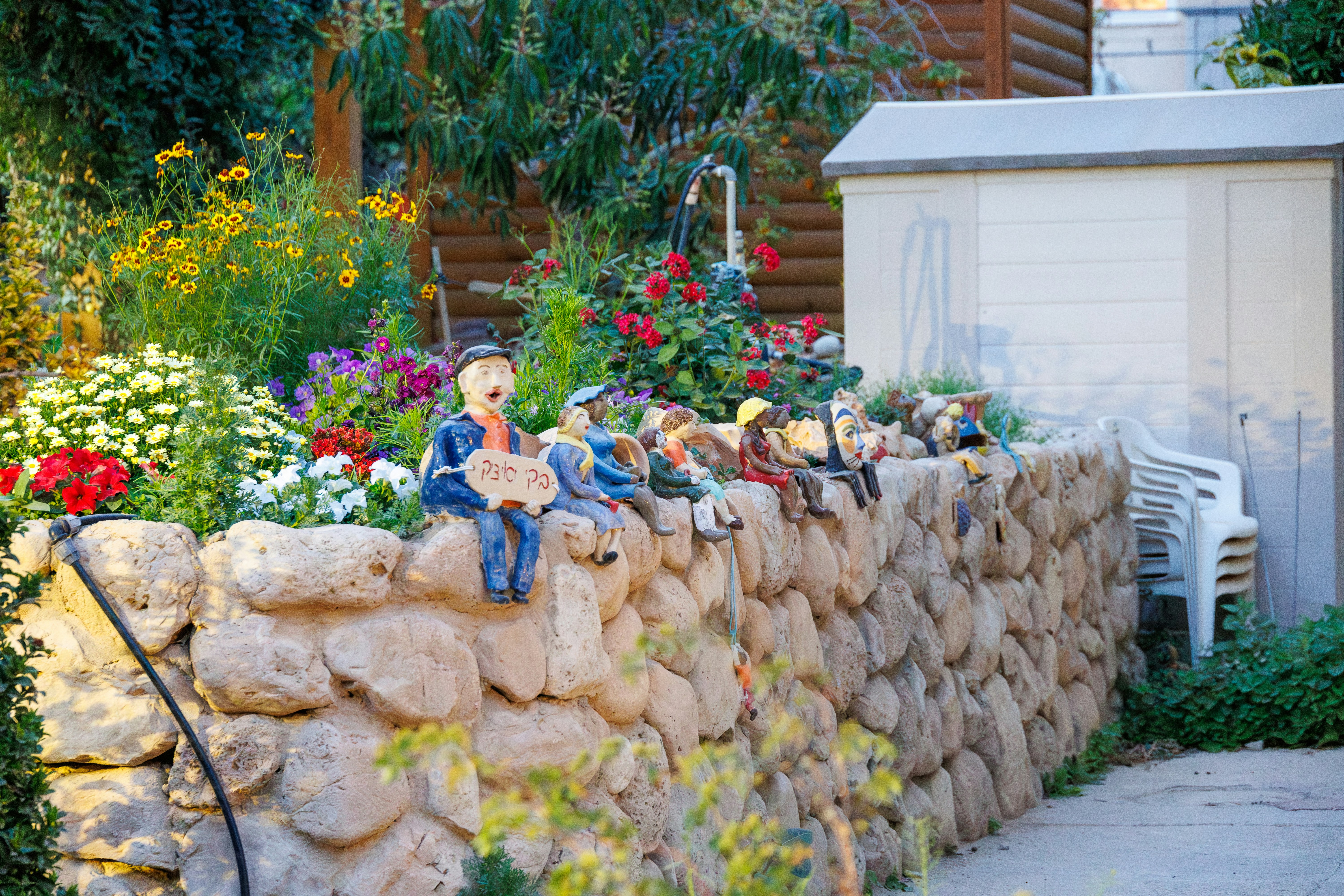 Garden of Figurines: A Lined Stone Terrace with Miniature Statues