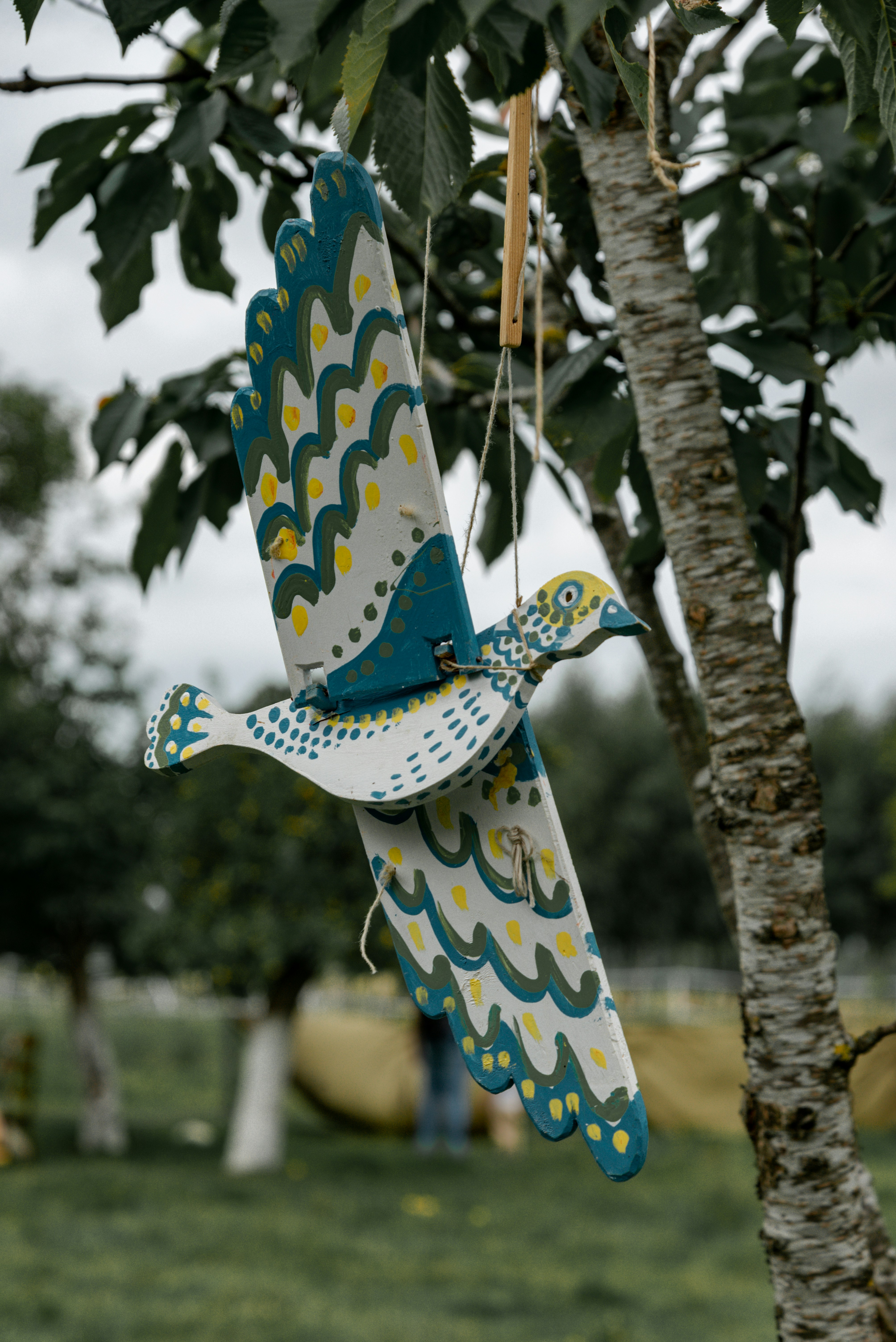 Whirligig of Wings: Painted Bird in the Orchard Breeze