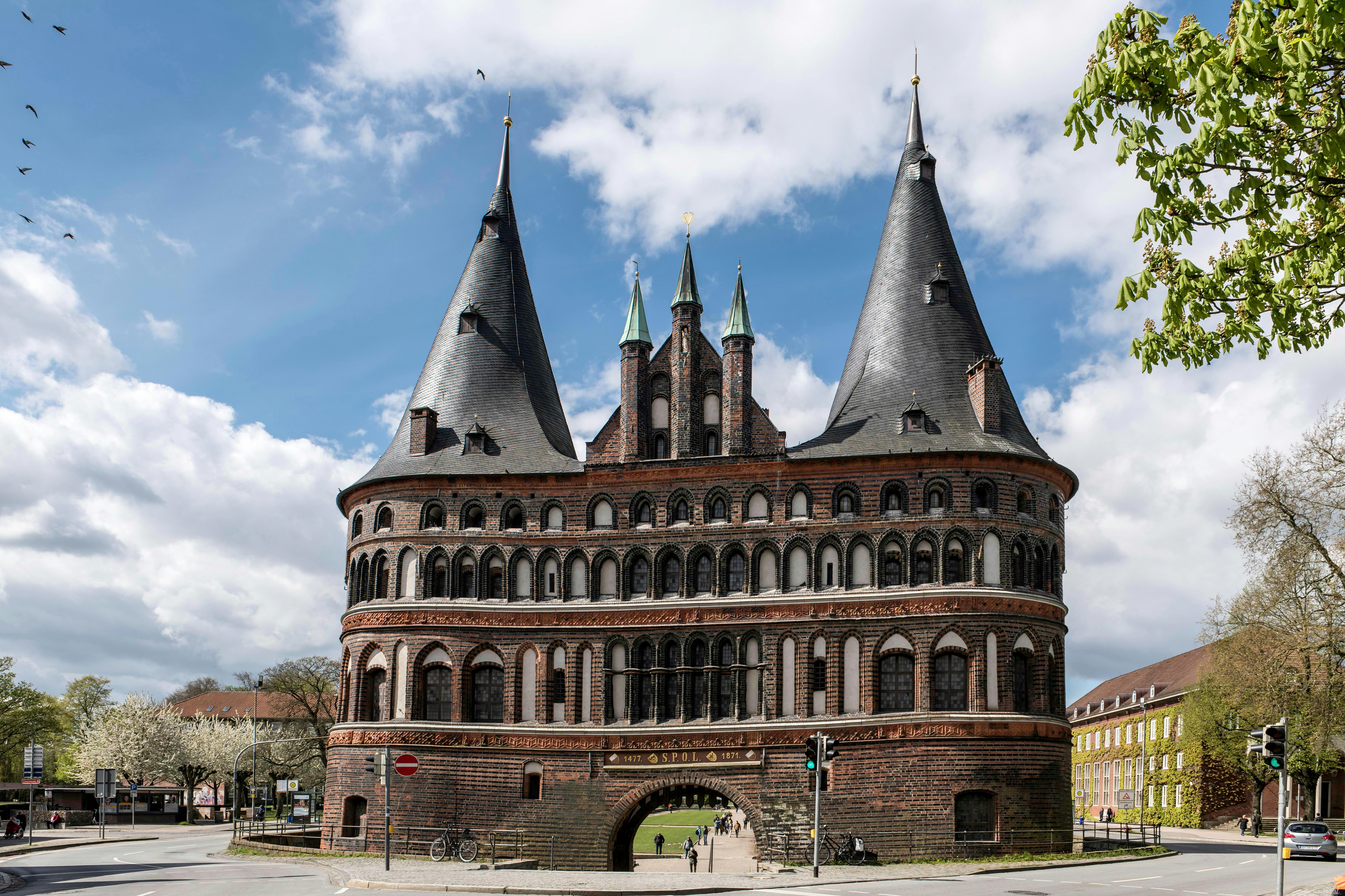 The Red Brick Gatehouse: A Round-arched Fortress Under a Skyscape