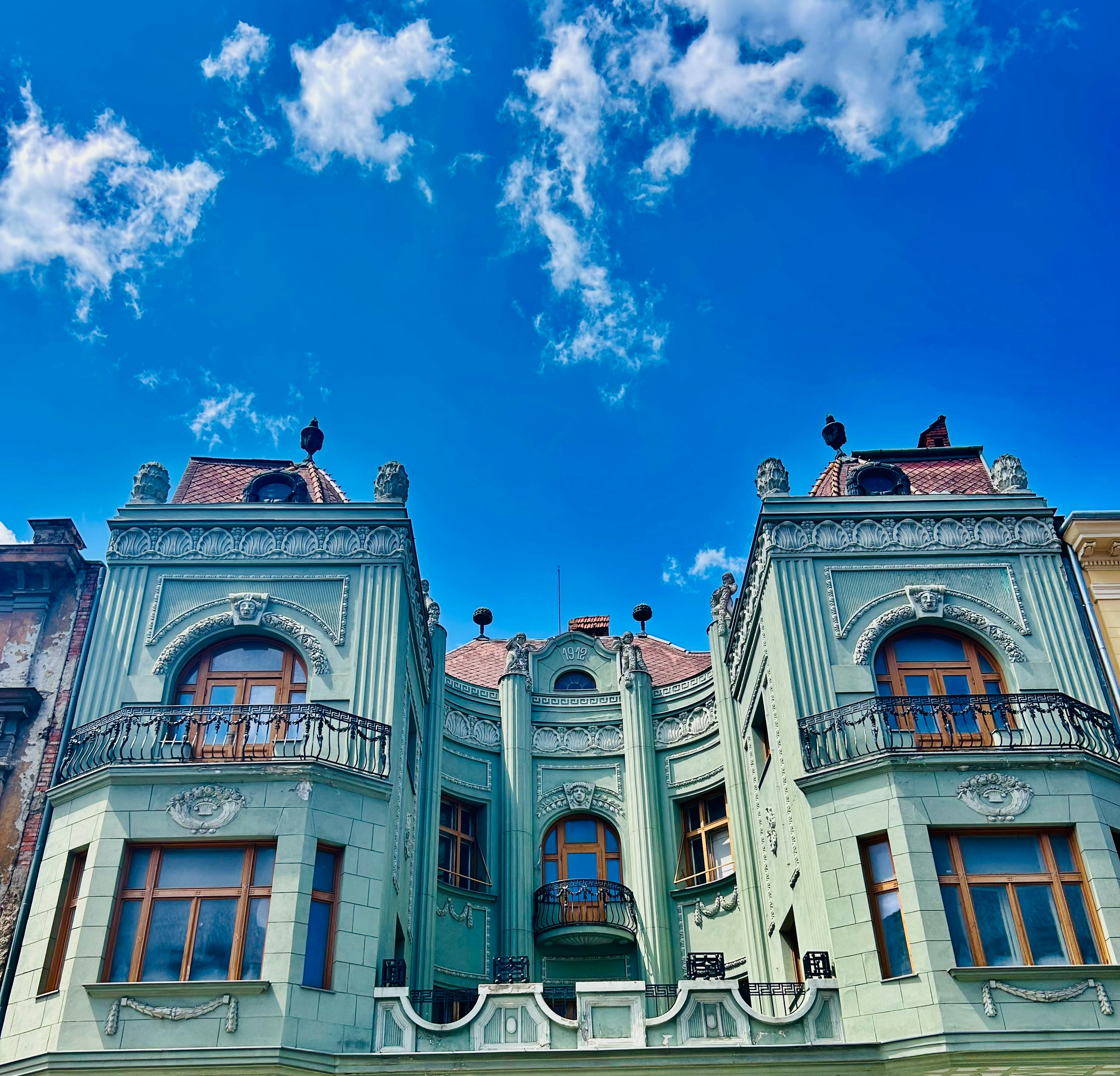 Ornate Facade beneath a Bright Blue Sky