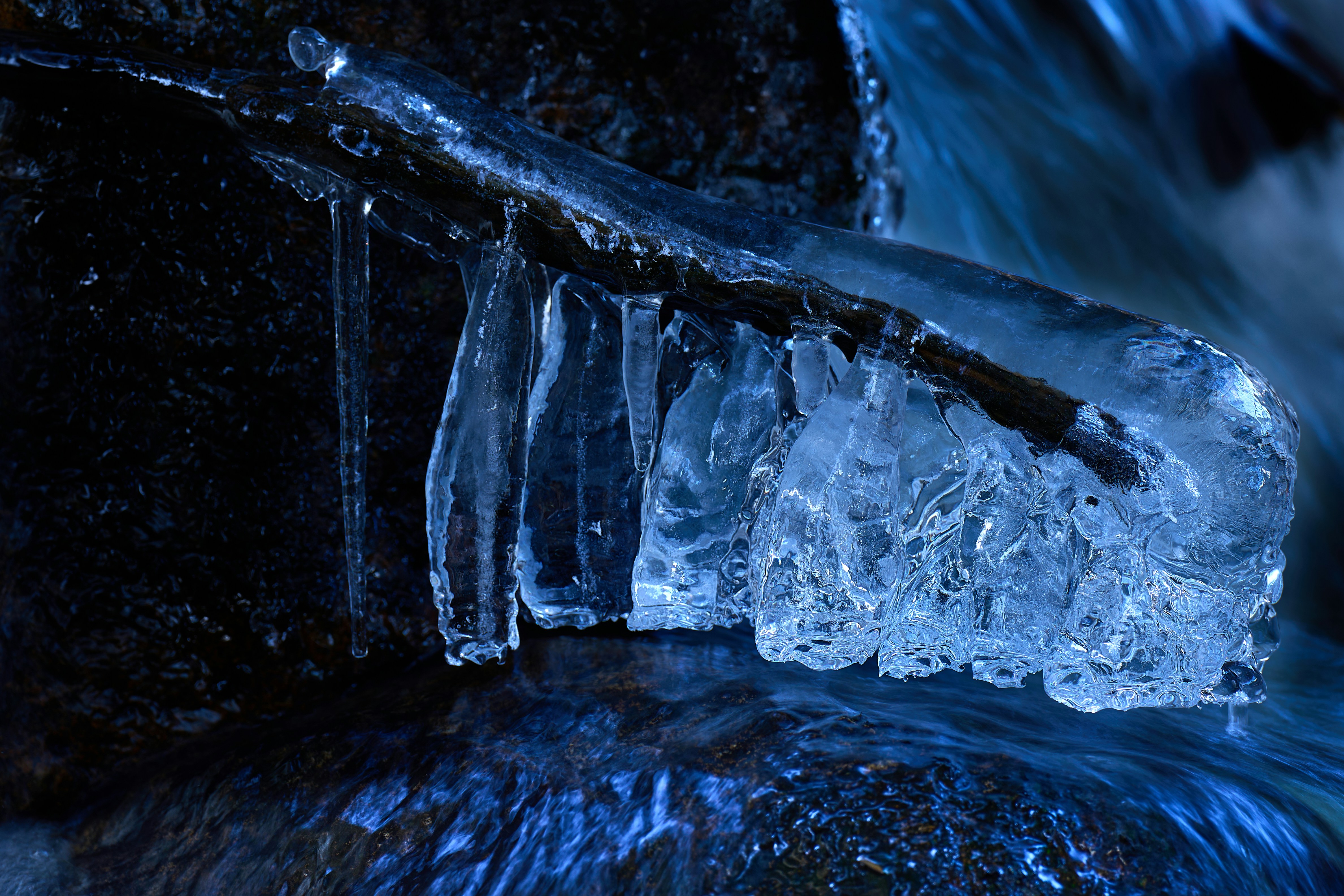 Glacial Carving: Icicles along a Frozen Crevice