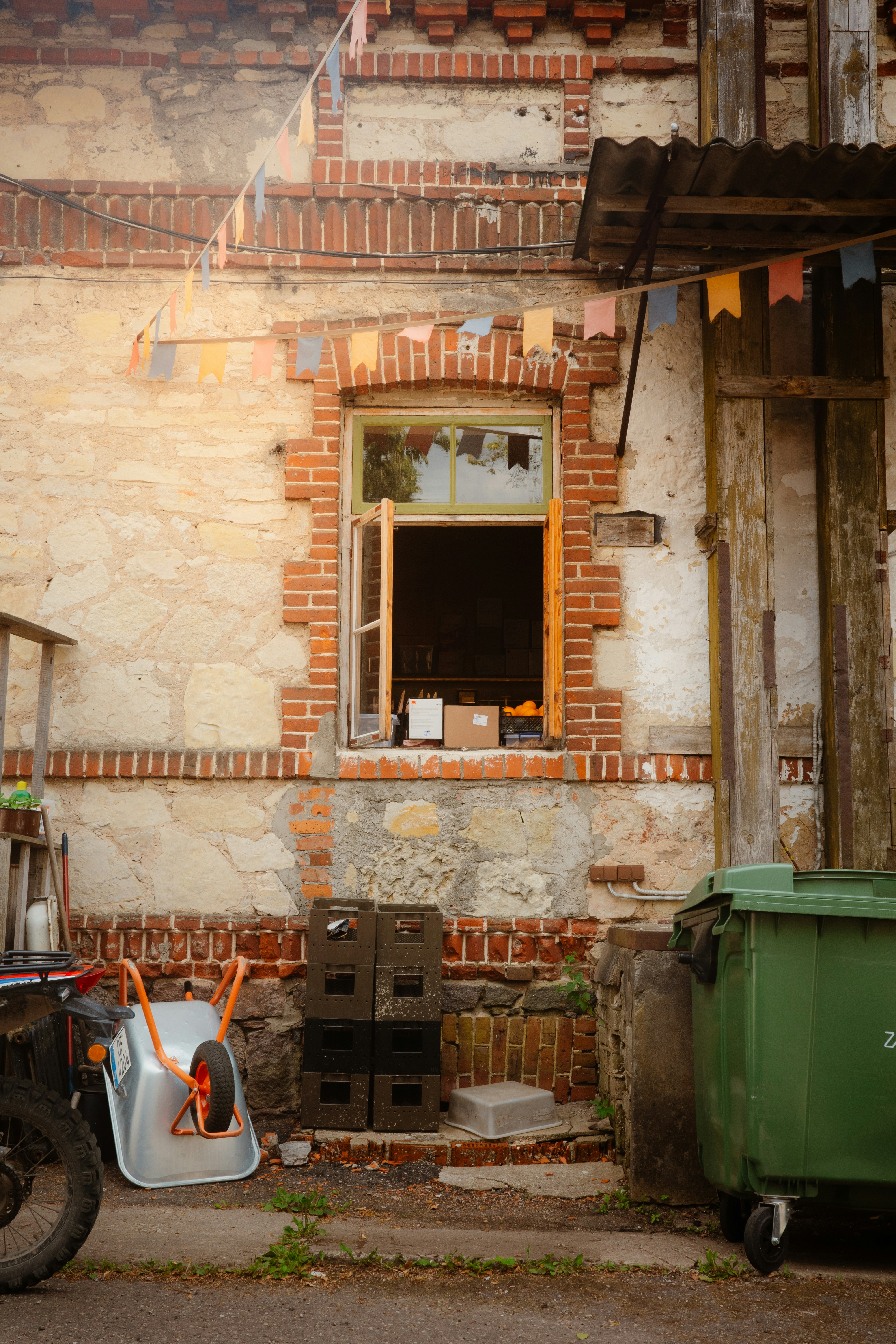 Weathered Workshop Window Framing a Quiet Morning Yard