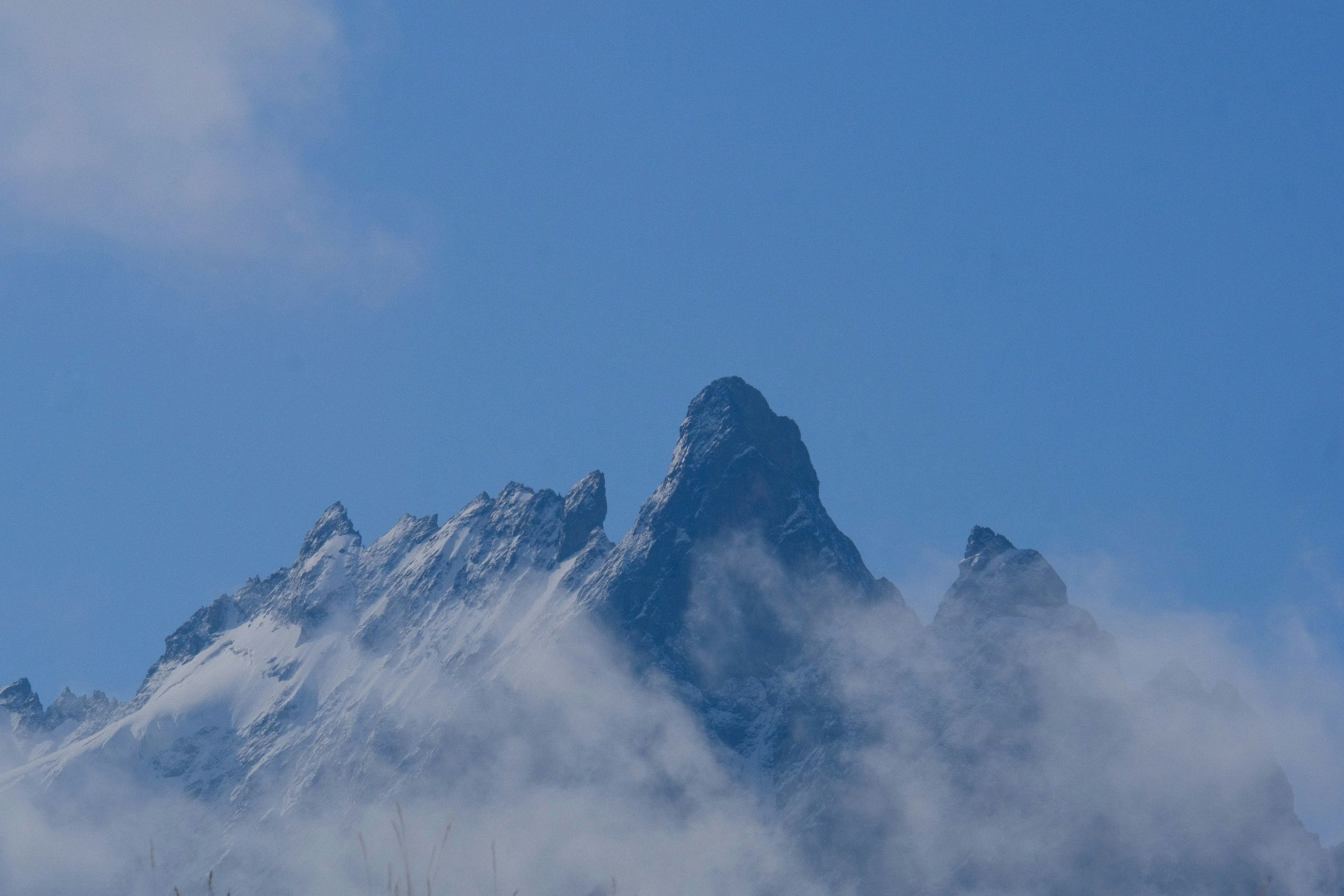 Azure Peak Rising Through Sea of Clouds