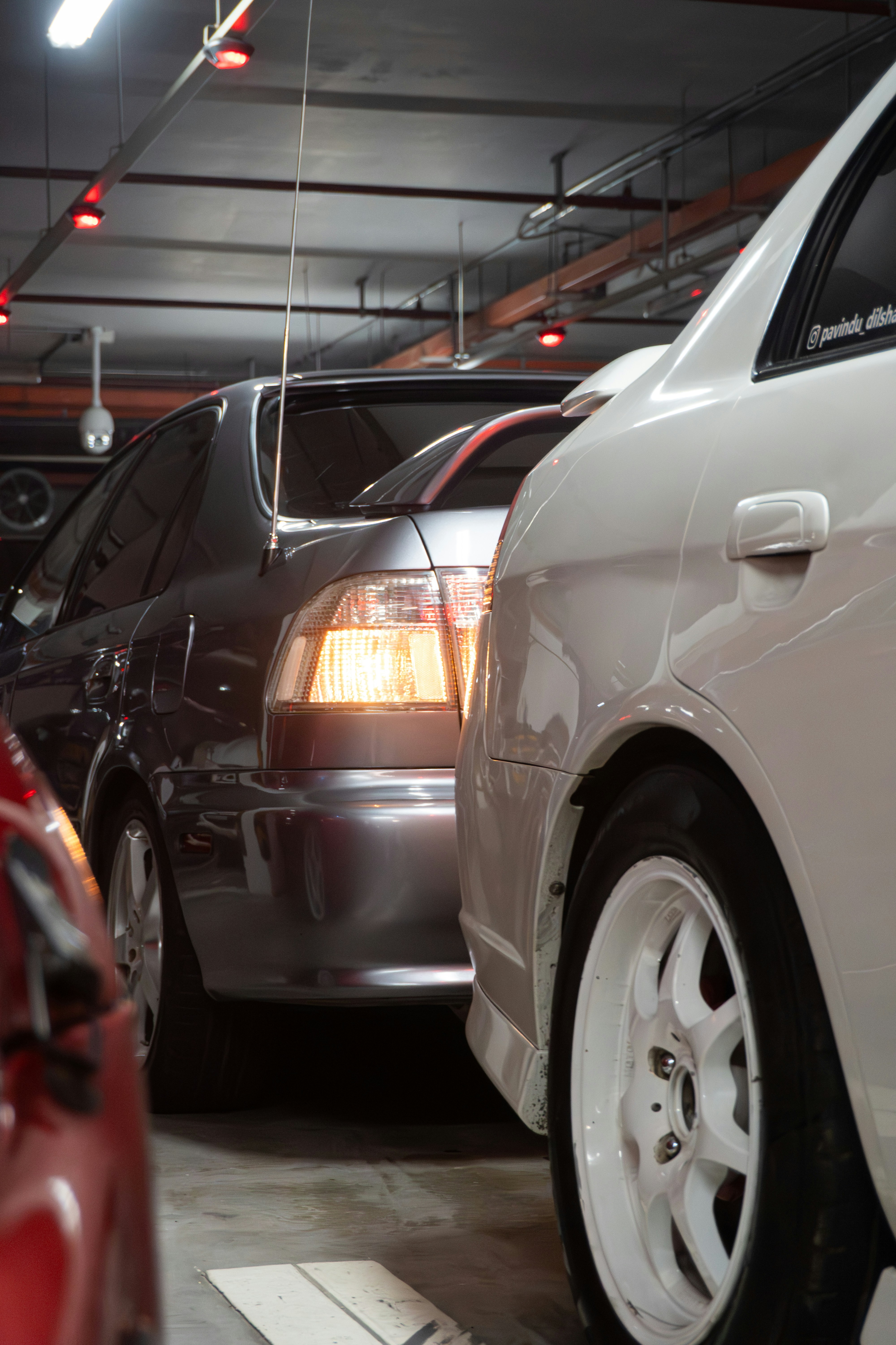 Morning Queue: Cars in a Dimly Lit Parking Garage
