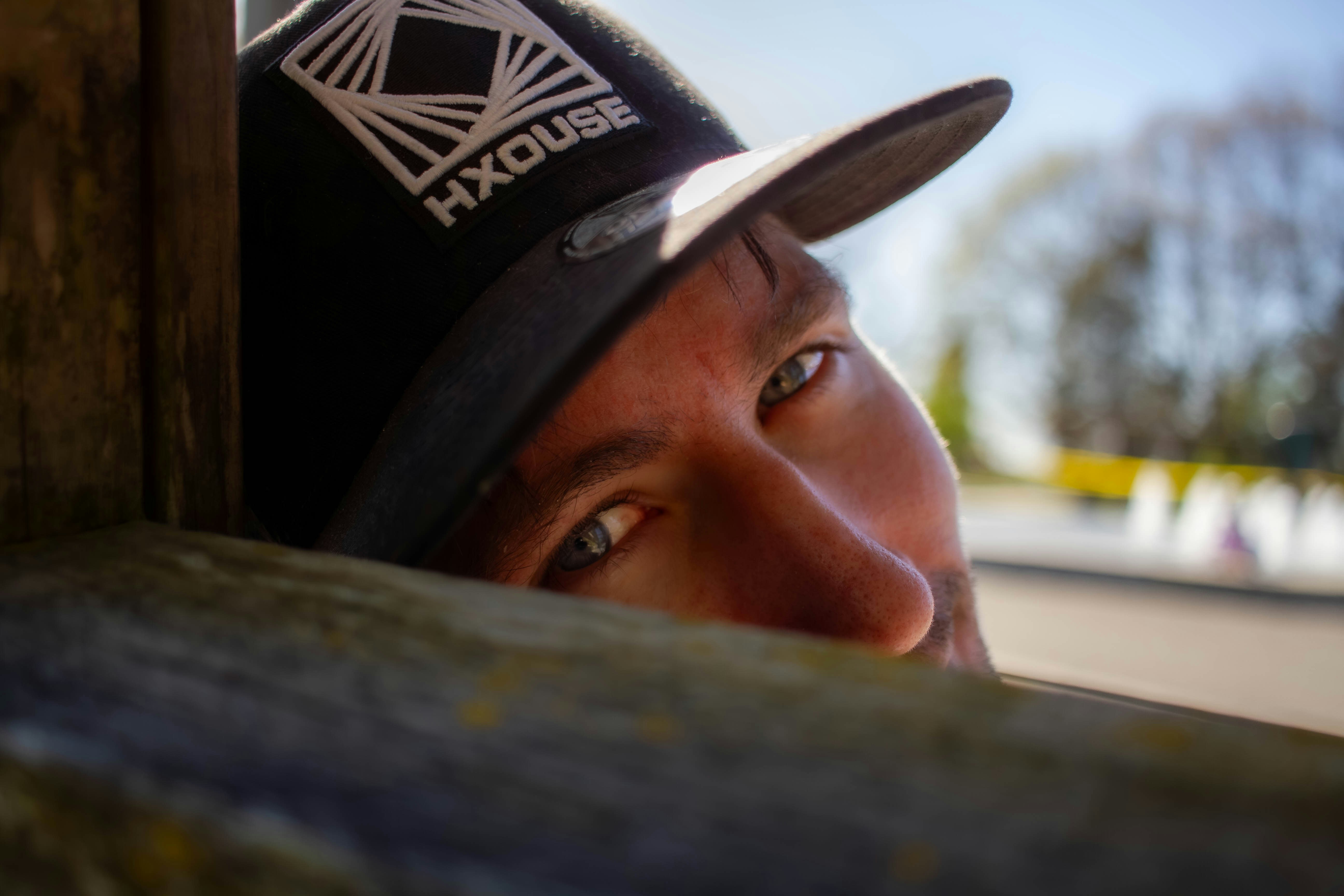 Near the Edge: A Glimpse of Focused Gaze Through Wood and Light