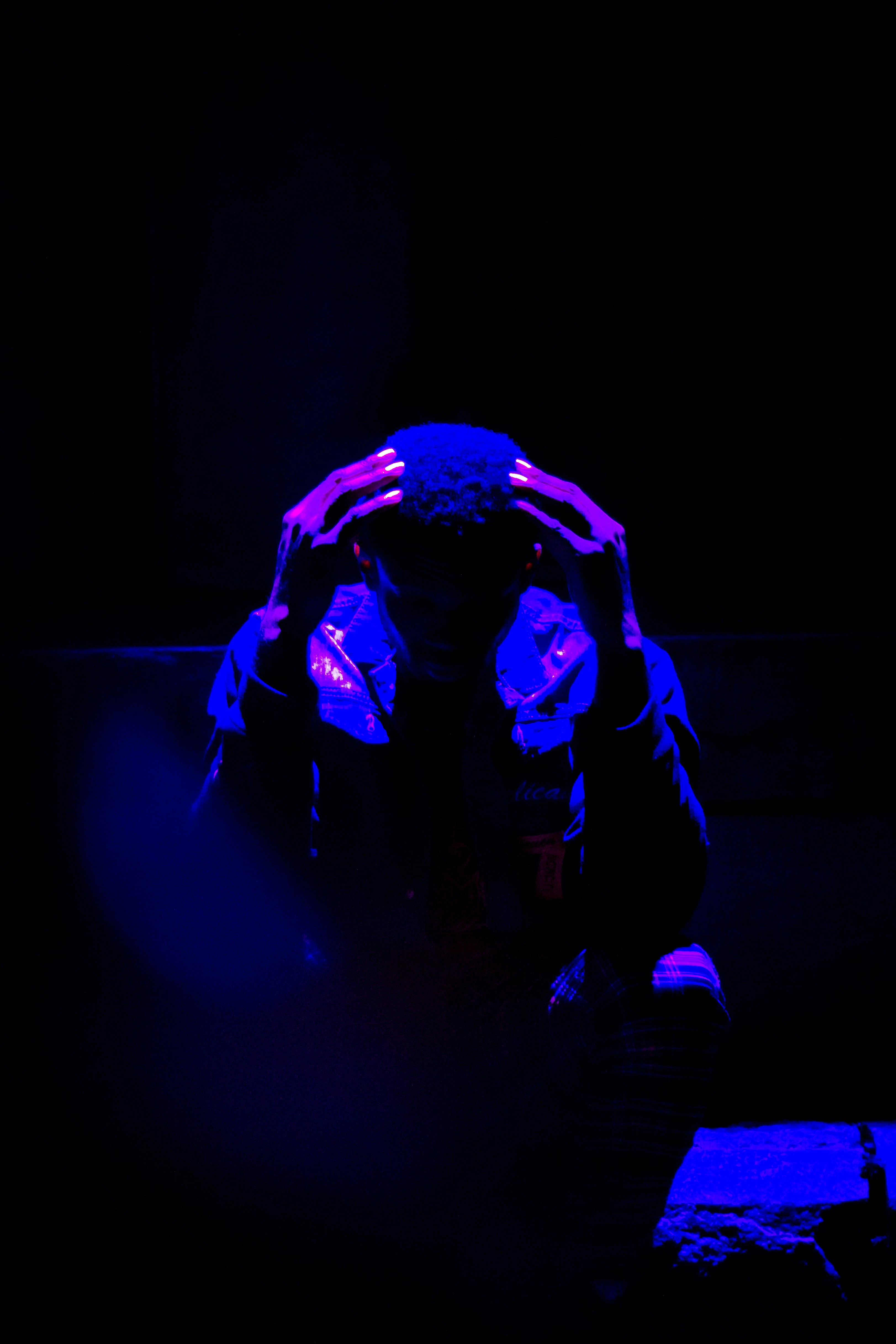 Blue Neon Portrait: A Silhouette in Nighttime Blue