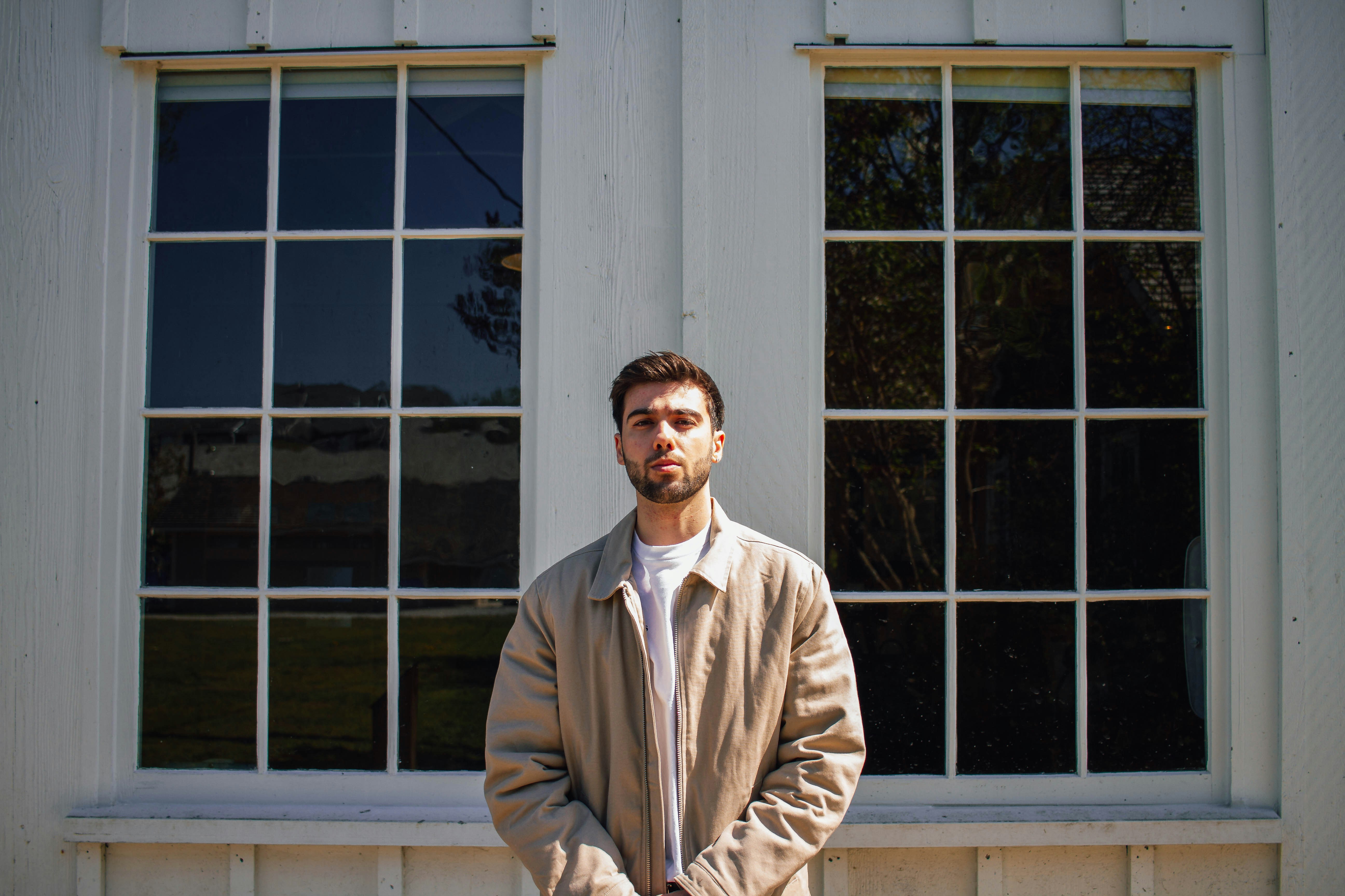 Portrait Beneath Tall Windows: Quiet Confidence in Soft Light