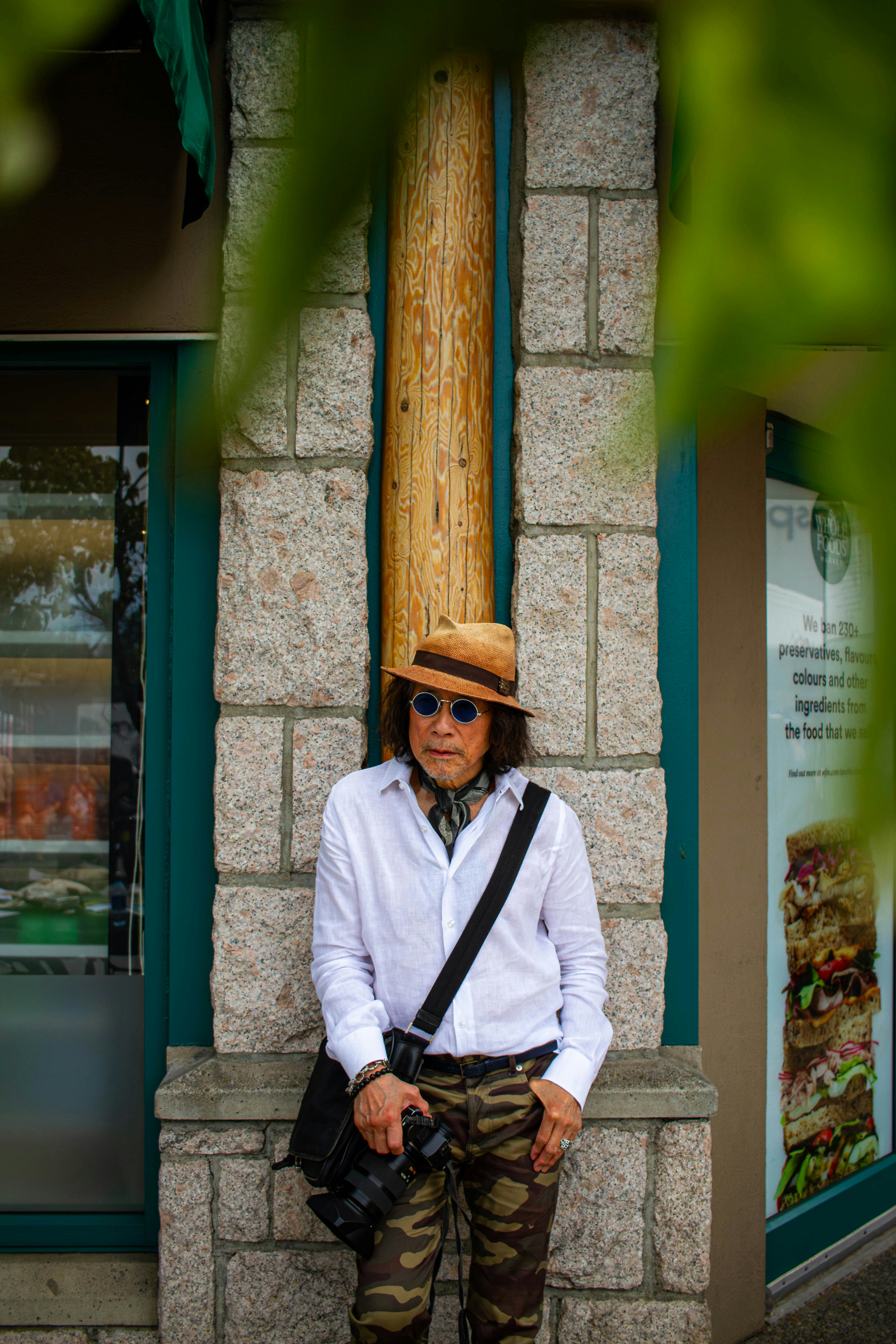 The Street Portraitist: A Hooded Stranger in a Stone Gate