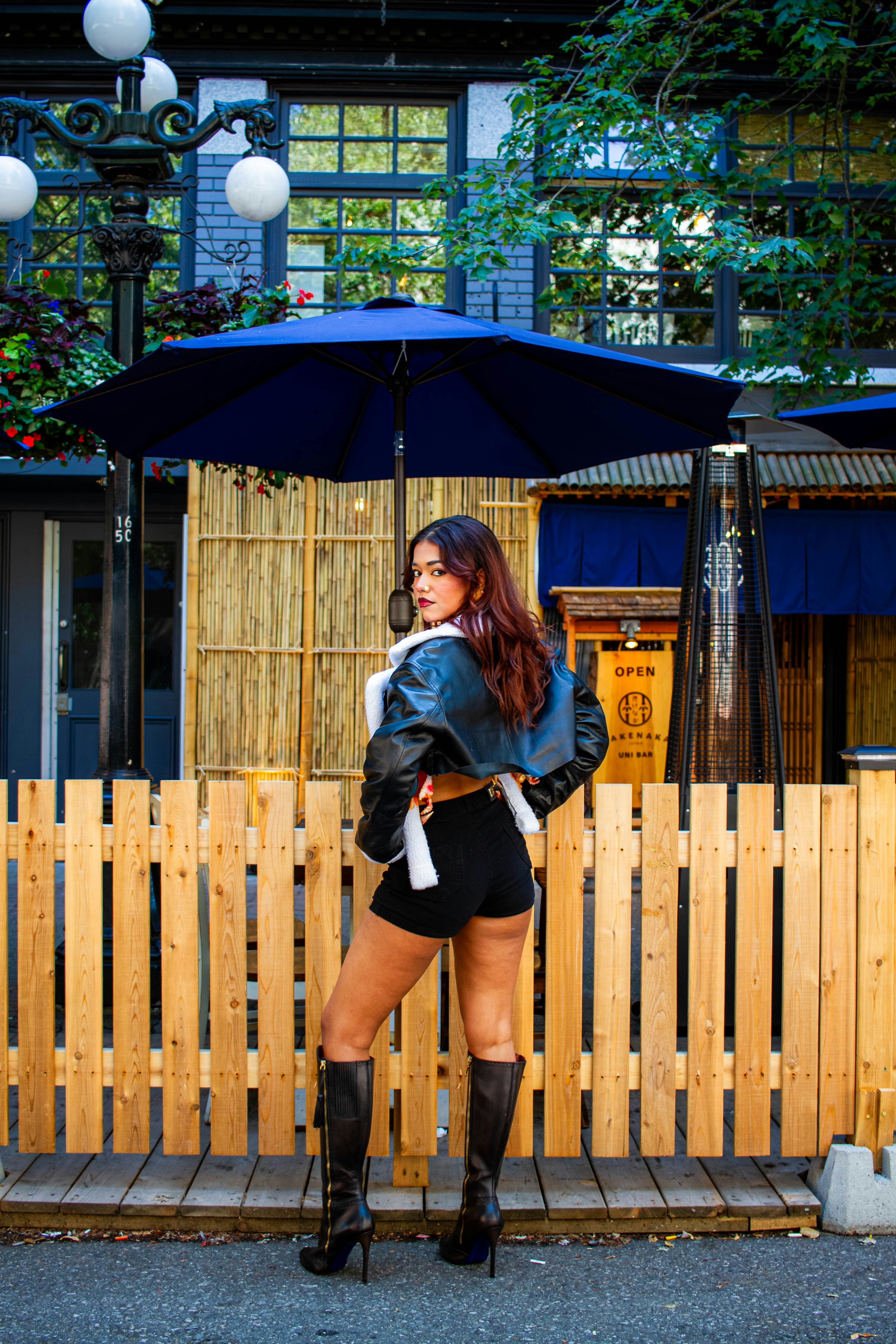 Midnight Neon: Streetwear Stroll Under a Blue Umbrella