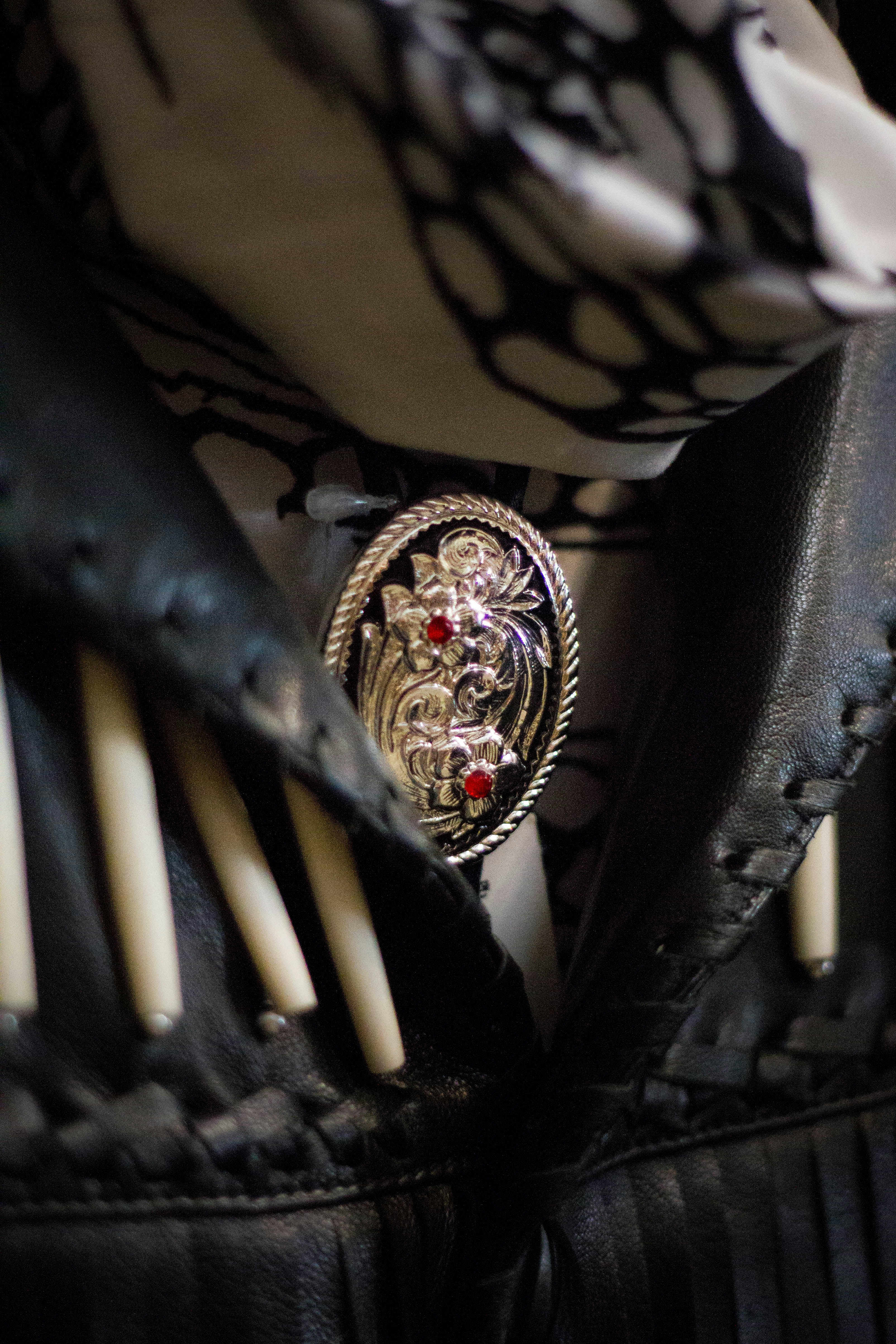Embellished Lapel Pin Hidden in Leather Layers
