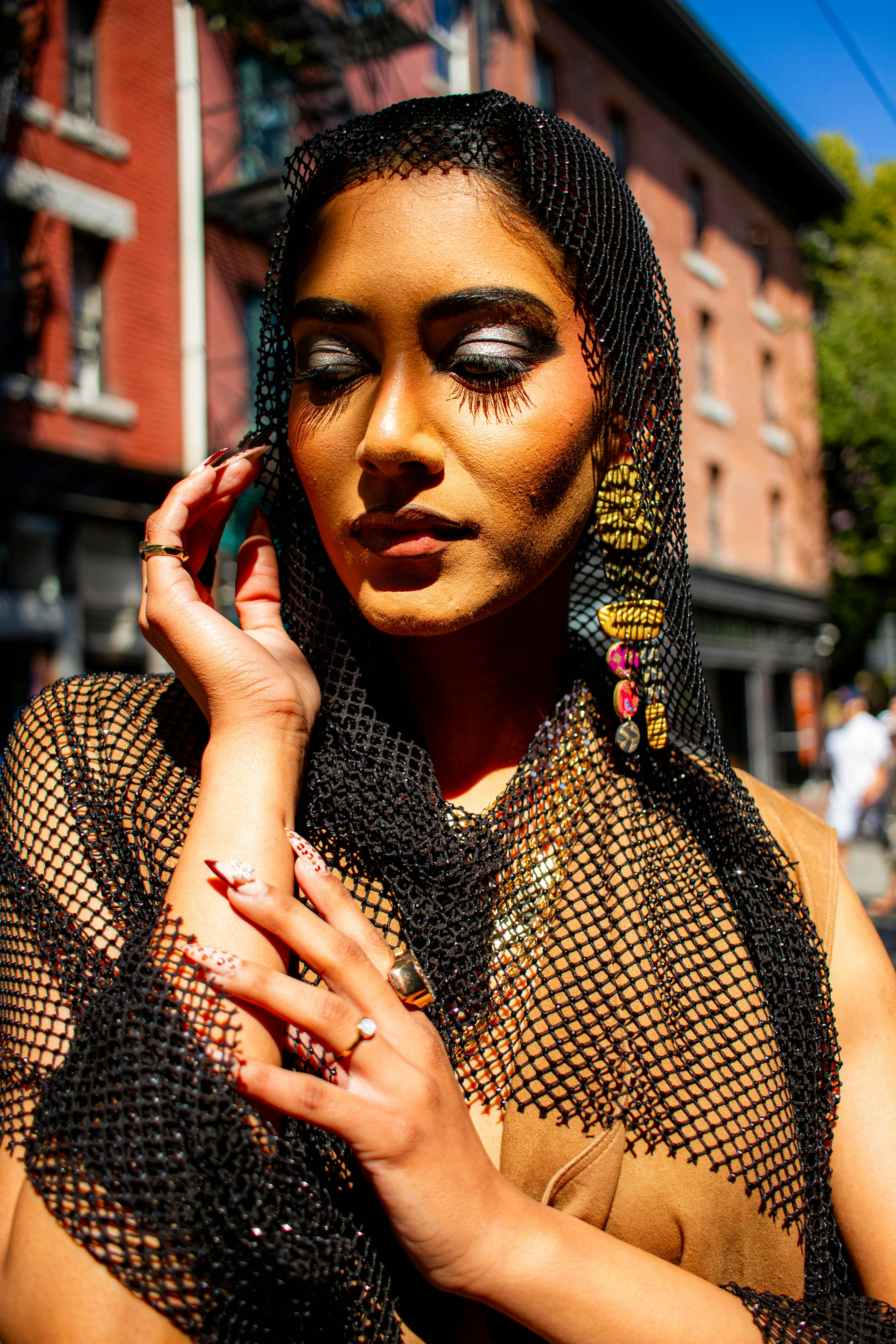 Velvet Veil and City Light: Portrait under Mesh and Sun