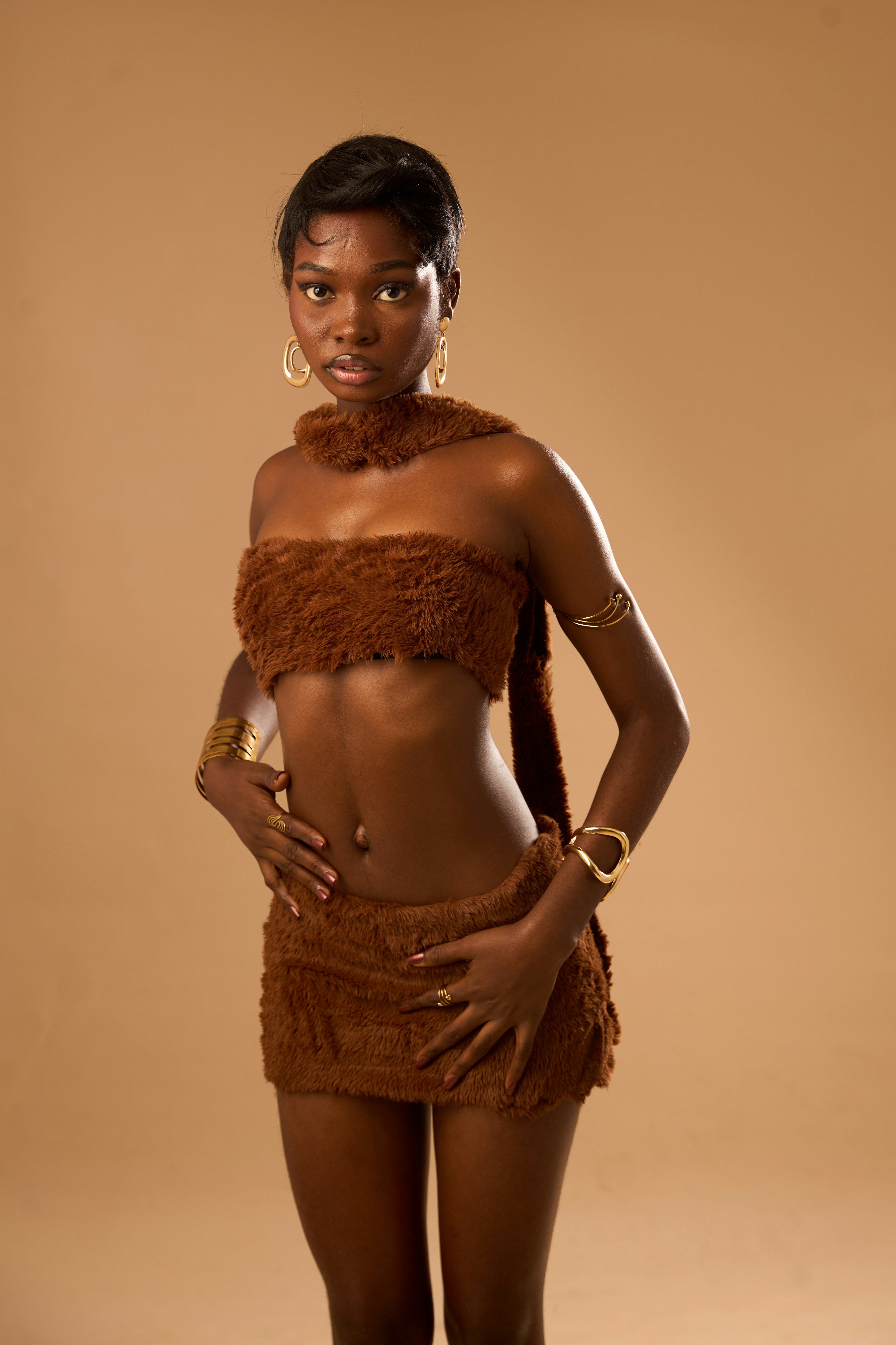 Golden Hour Grace: A Studio Portrait in Warm Tones