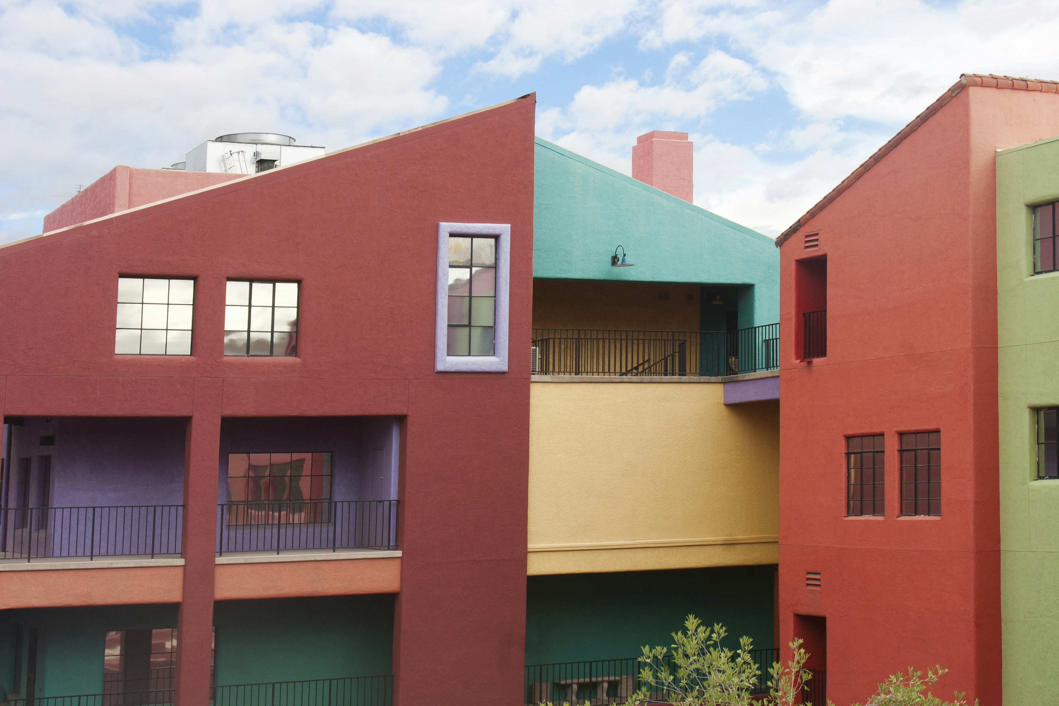 Colorful Architecture: A Facade Symphony of Reds, Teals, and Mustard