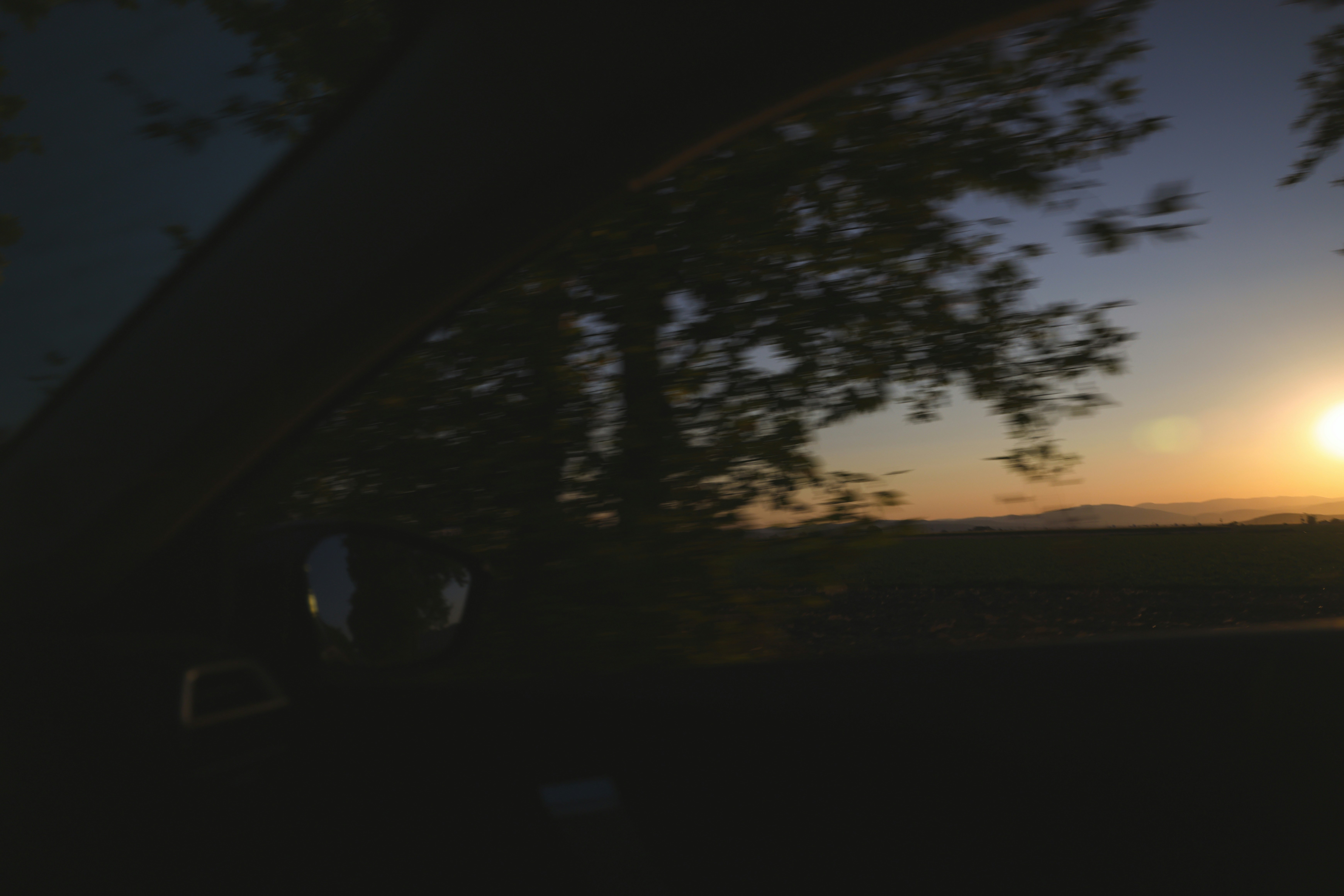 Sunlit Horizon from a Dark Car Window