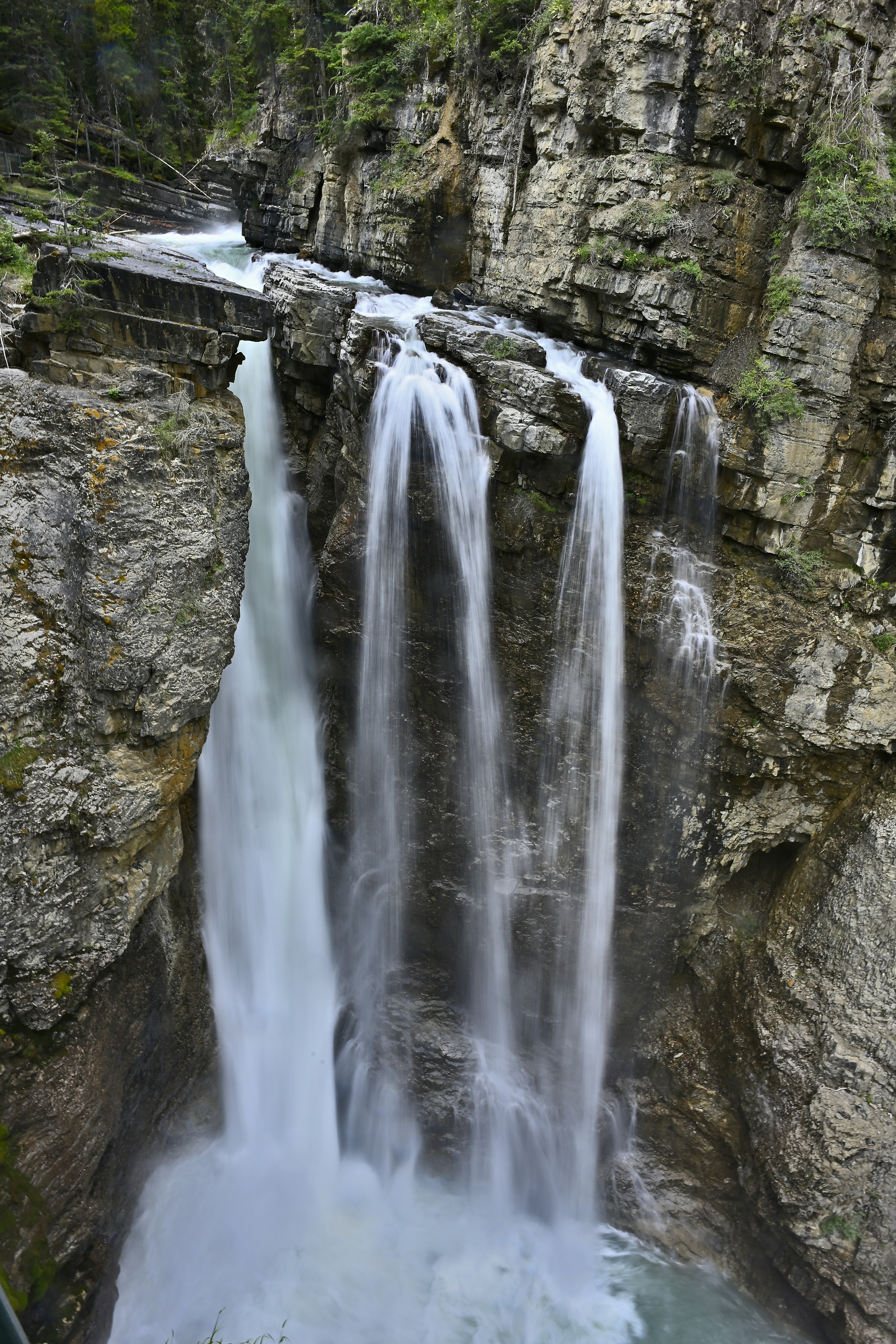 Vertical Curtain: A Multi-Threaded Cascade Leaping from Granite Cliffs
