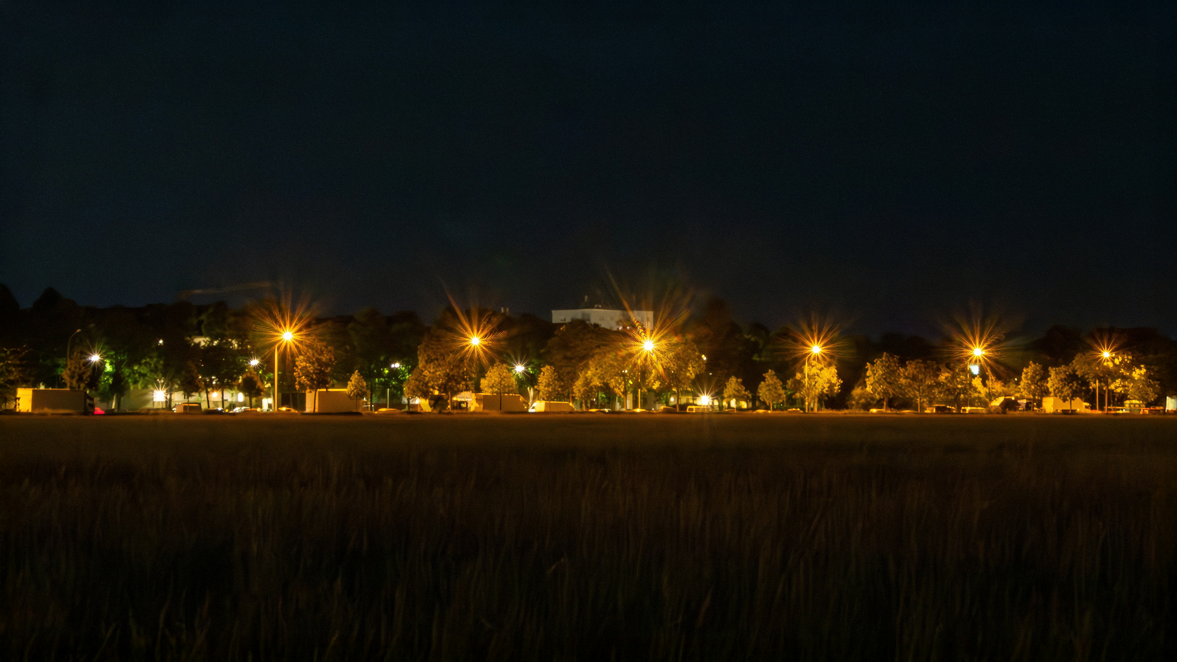 Night Lights Over a Quiet Field