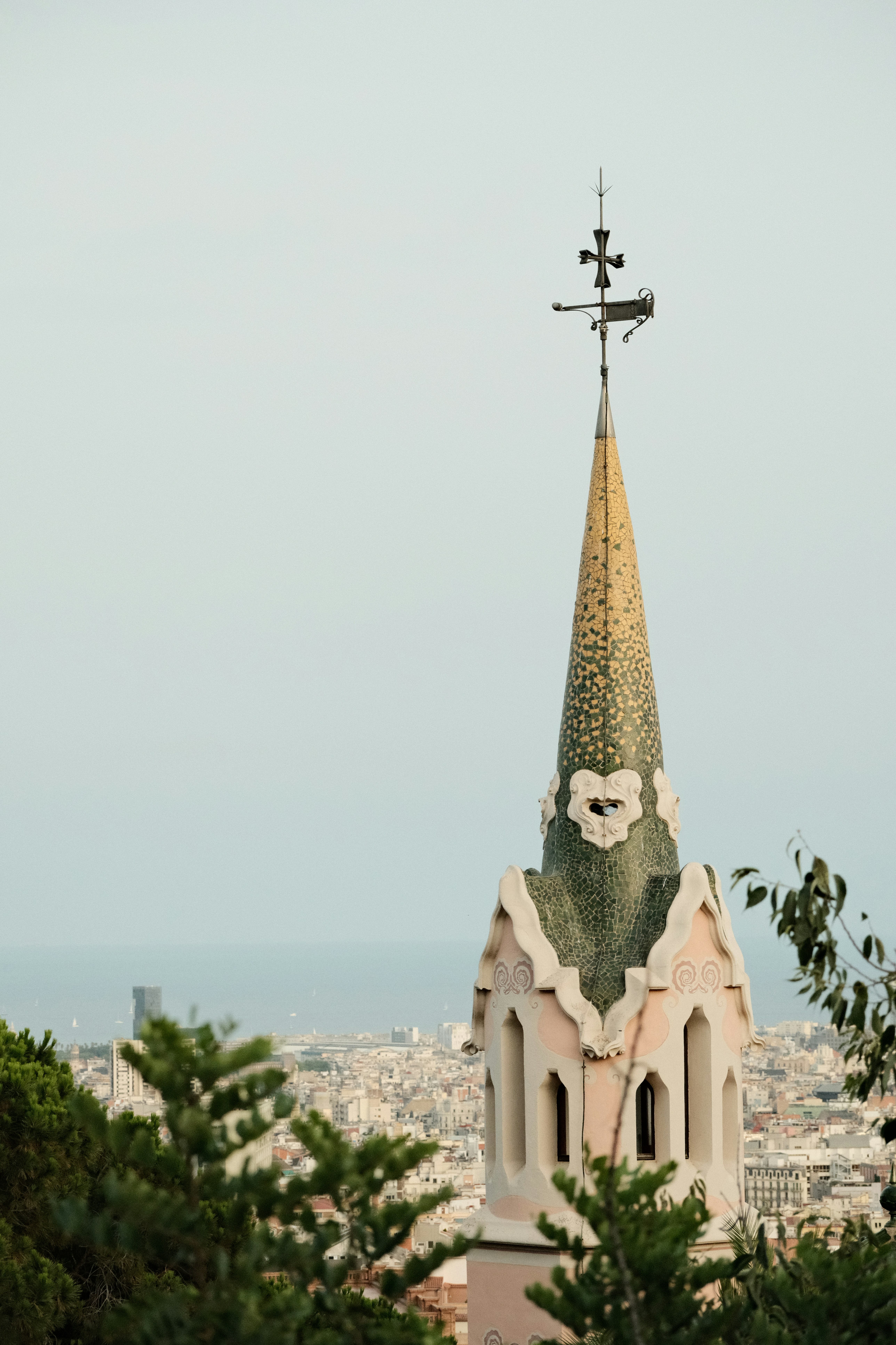 Spire of Barcelona: A Distant Crown Above Rooftops