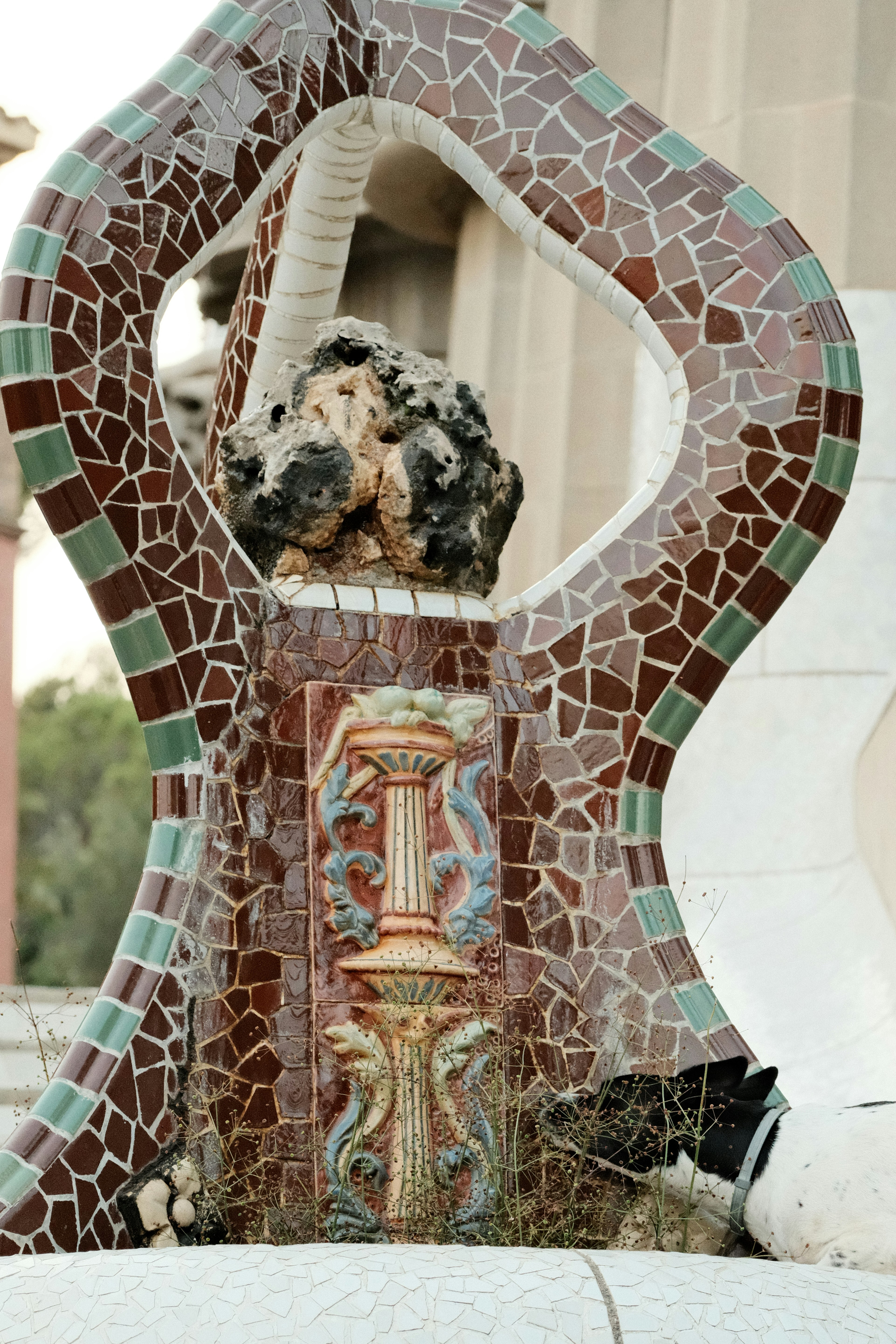 Mosaic Archway Framing a Weathered Stone Detail