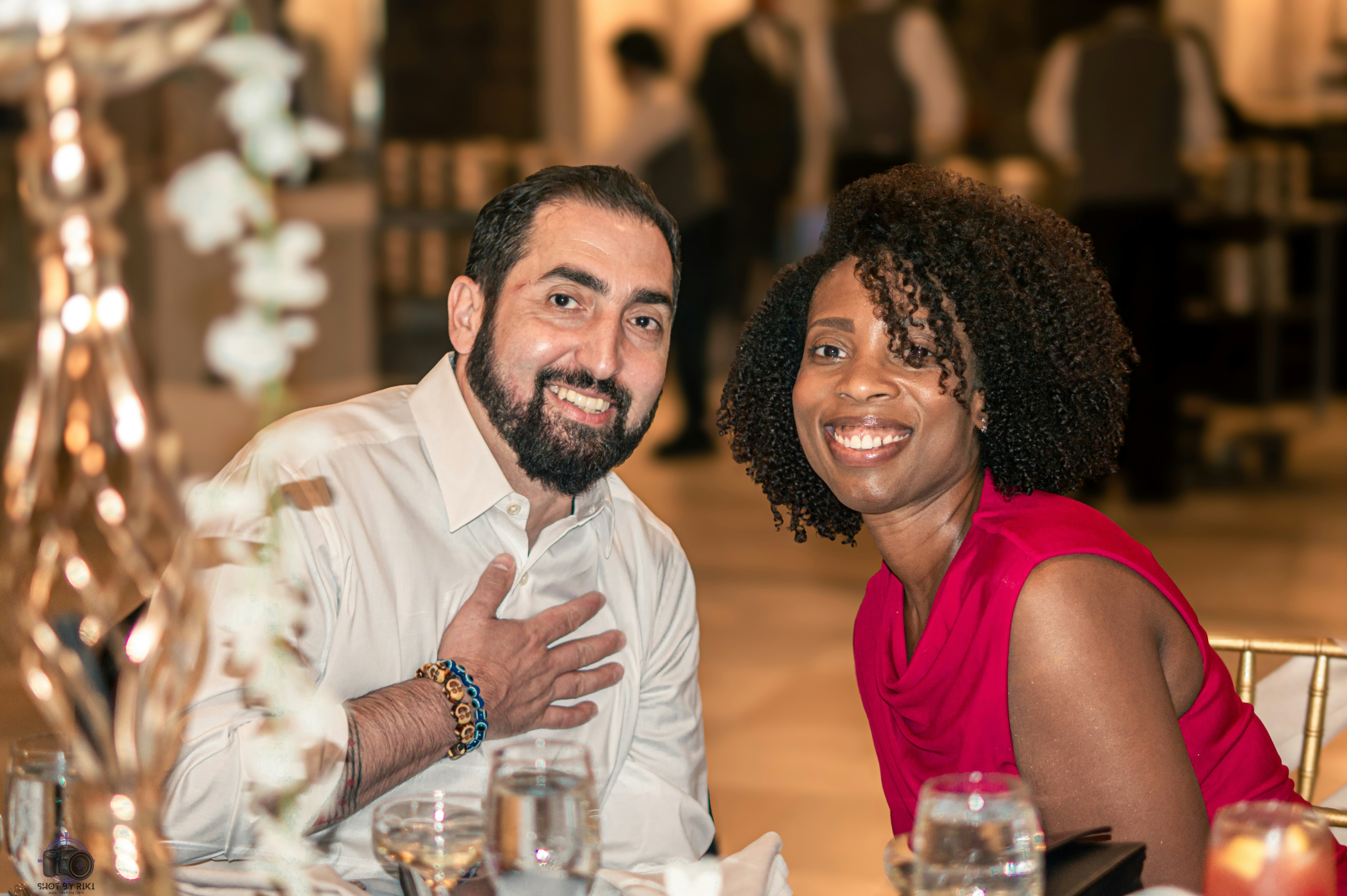 Two Guests Toasting at an Elegant Dinner Event