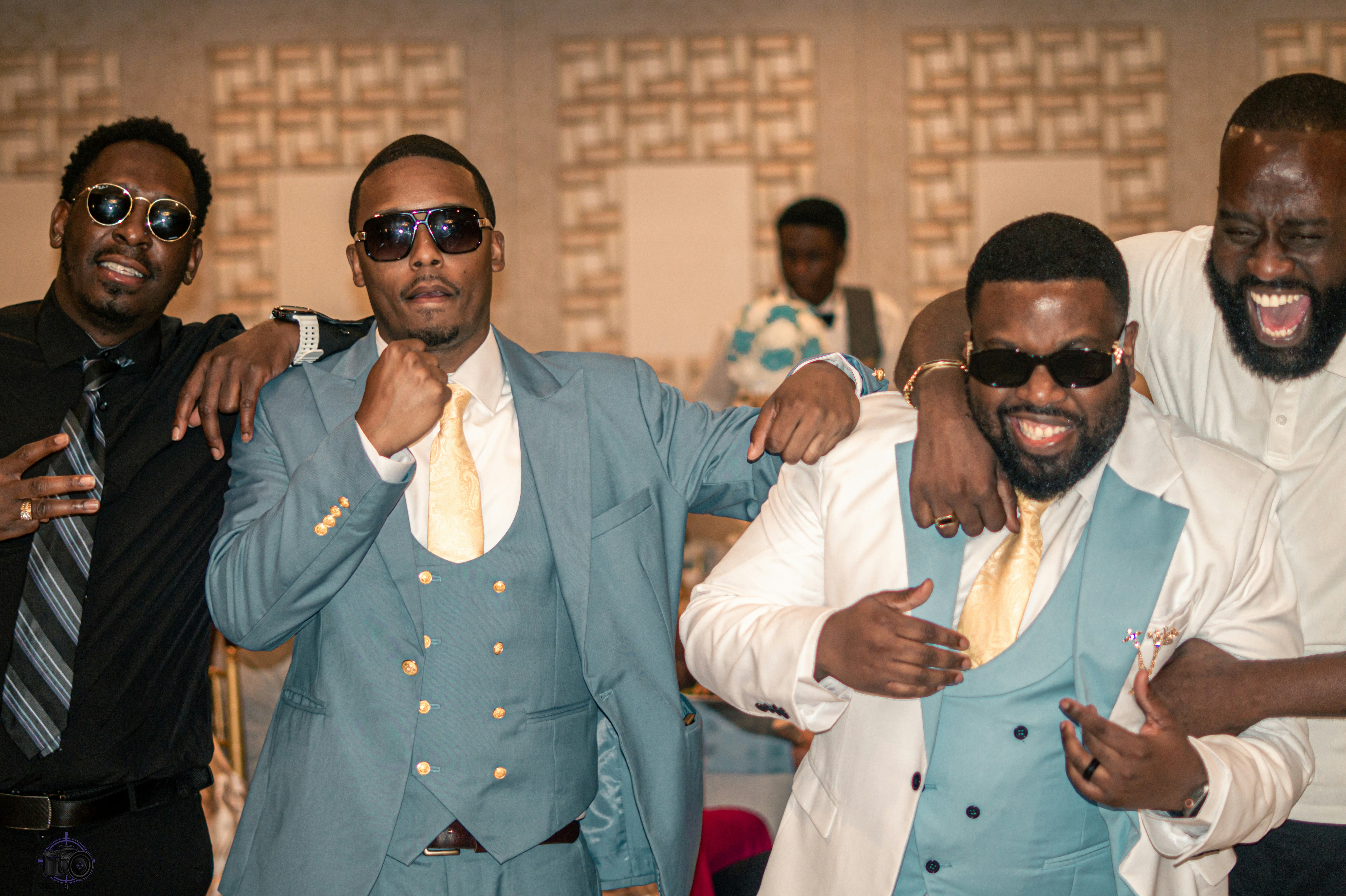 Laughter and Laughter: A Dapper Crew in Coordinated Blue