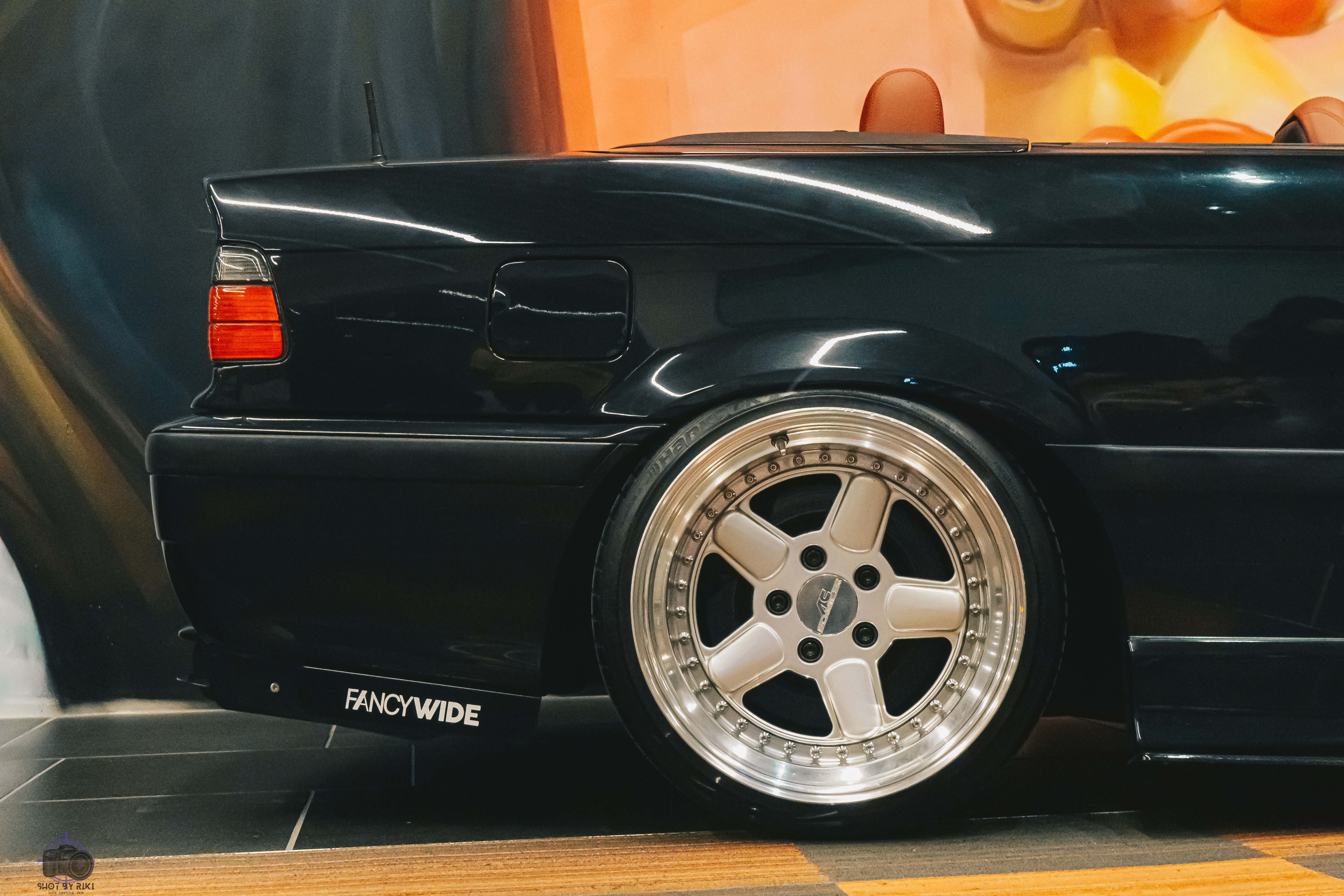 Low-Slung Black Beauty: A Glimpse Under the Wheel Arch