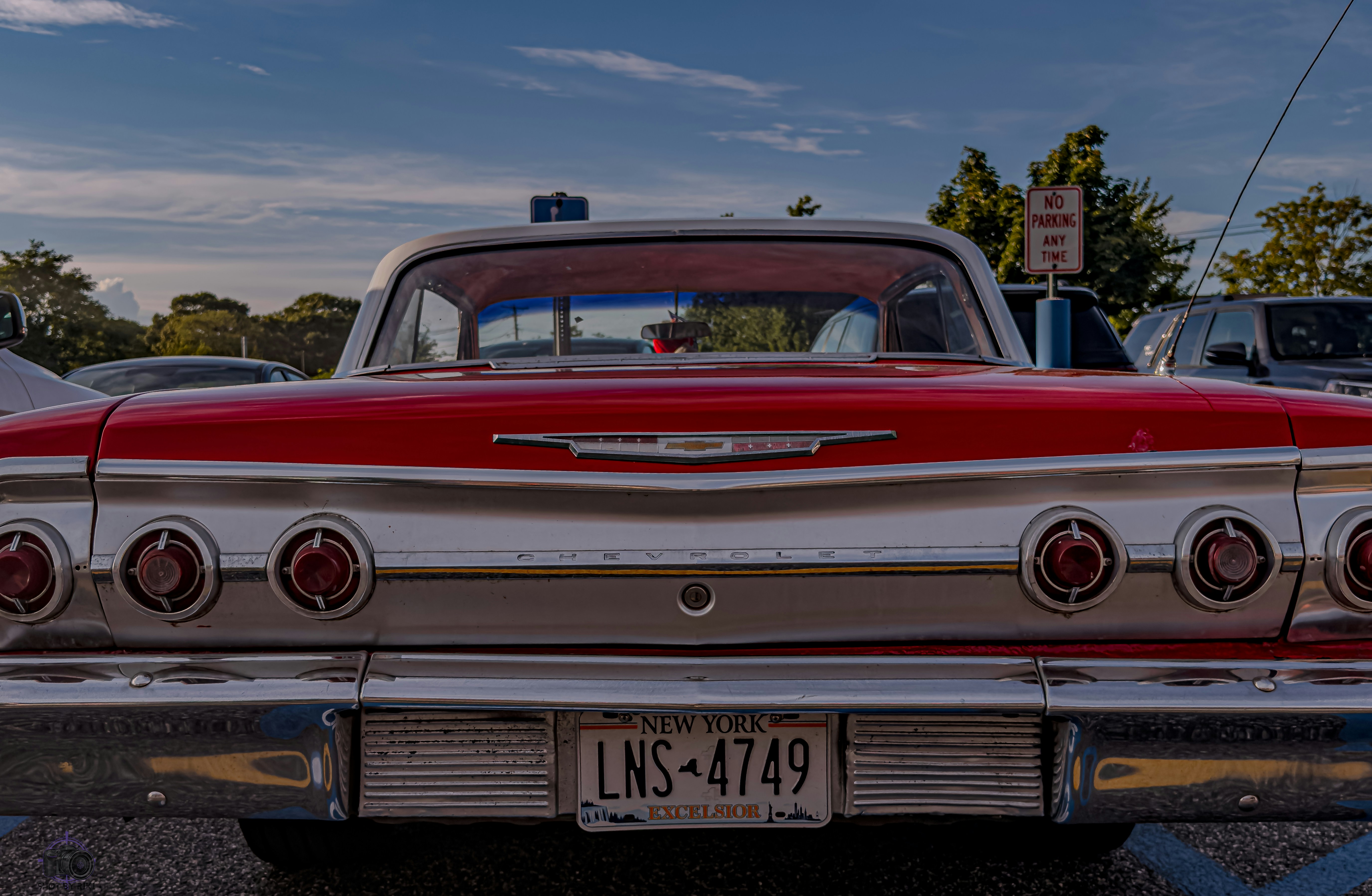 Chrome Echo: Tailfin Sunset on a Classic Chevy