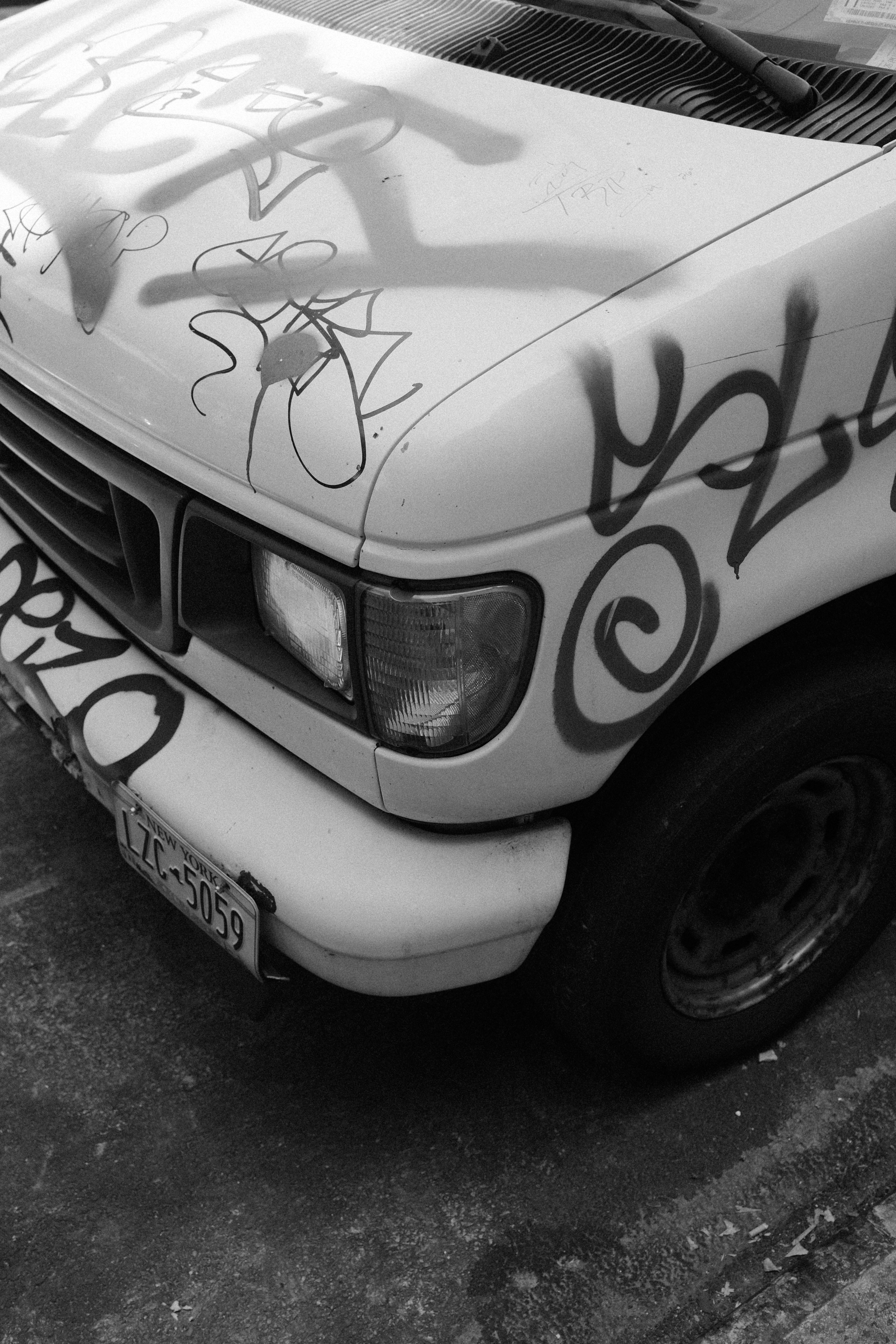 Graffiti-Tagged Front End of a Weathered Panel van