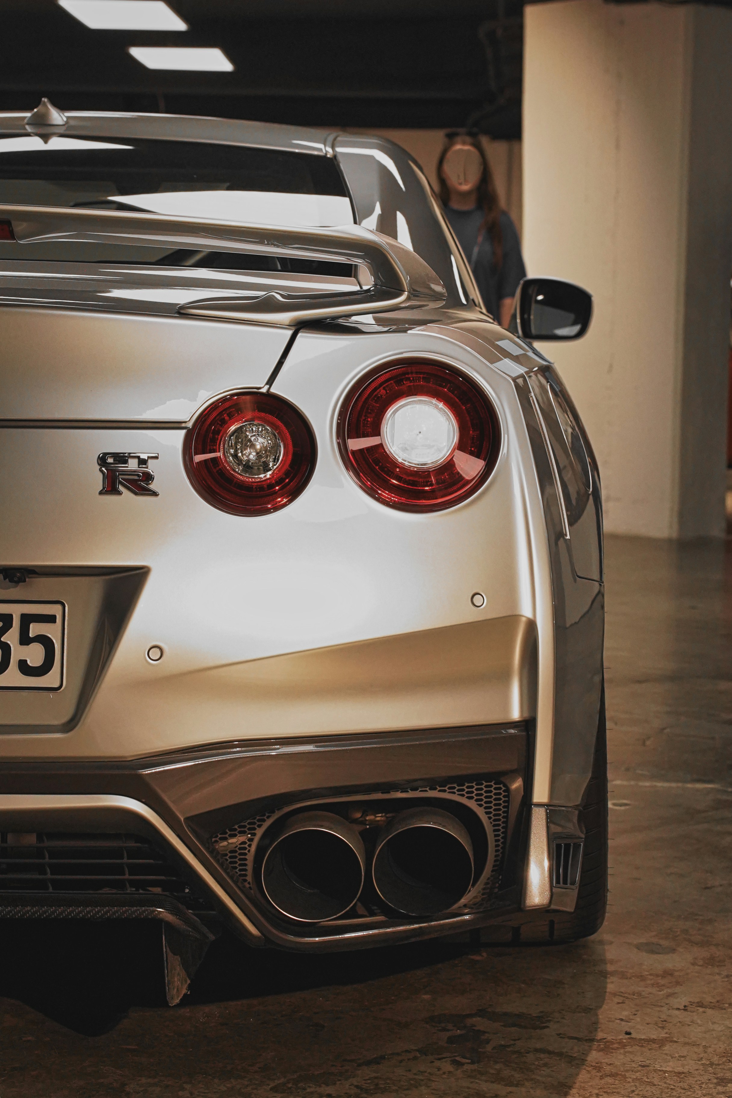 Rear Quarter View: Power and Shine of a Nissan GT-R in a Parking Garage