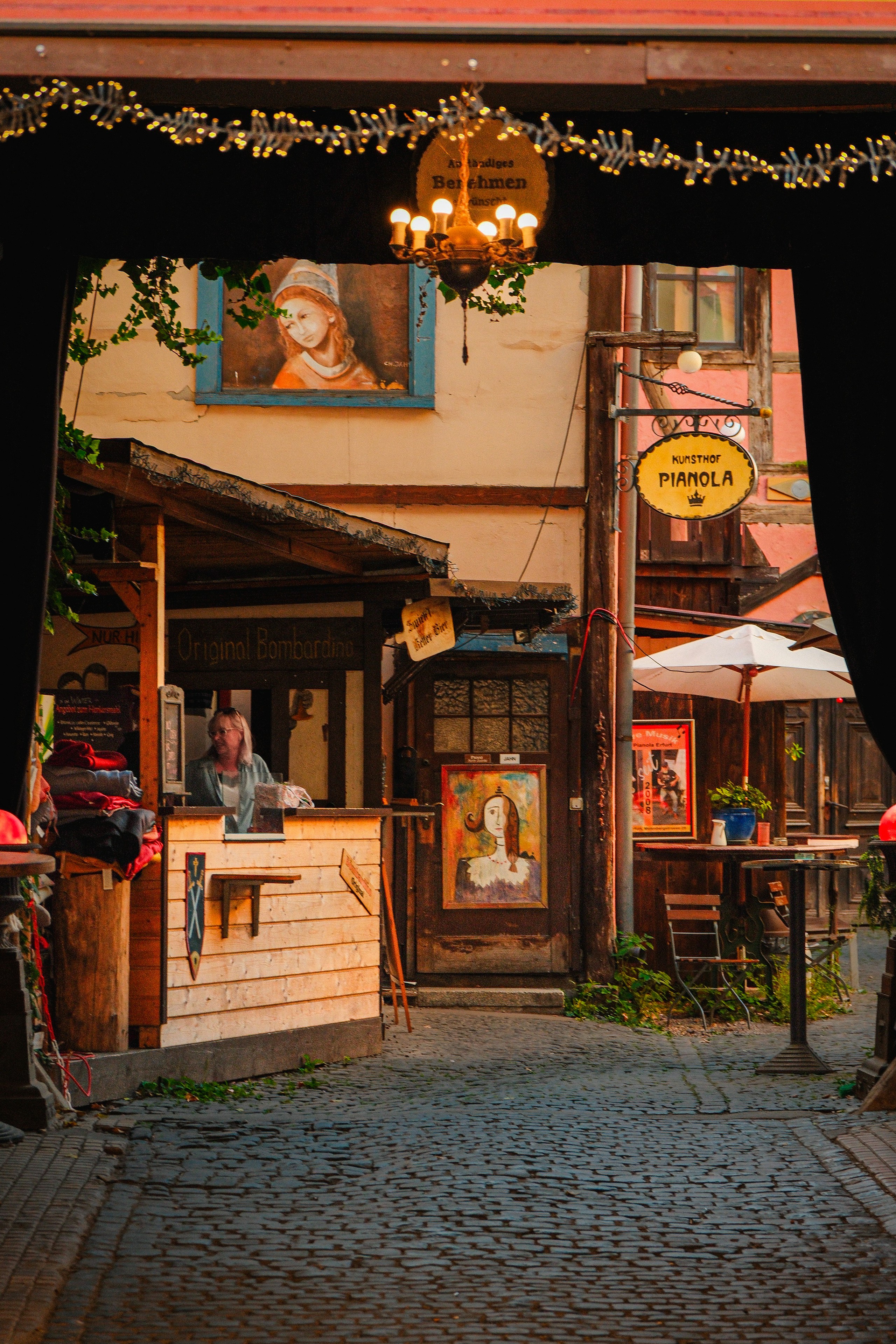 Cobbled Courtyard Stage: A Quiet Oasis Framed by Lantern Light