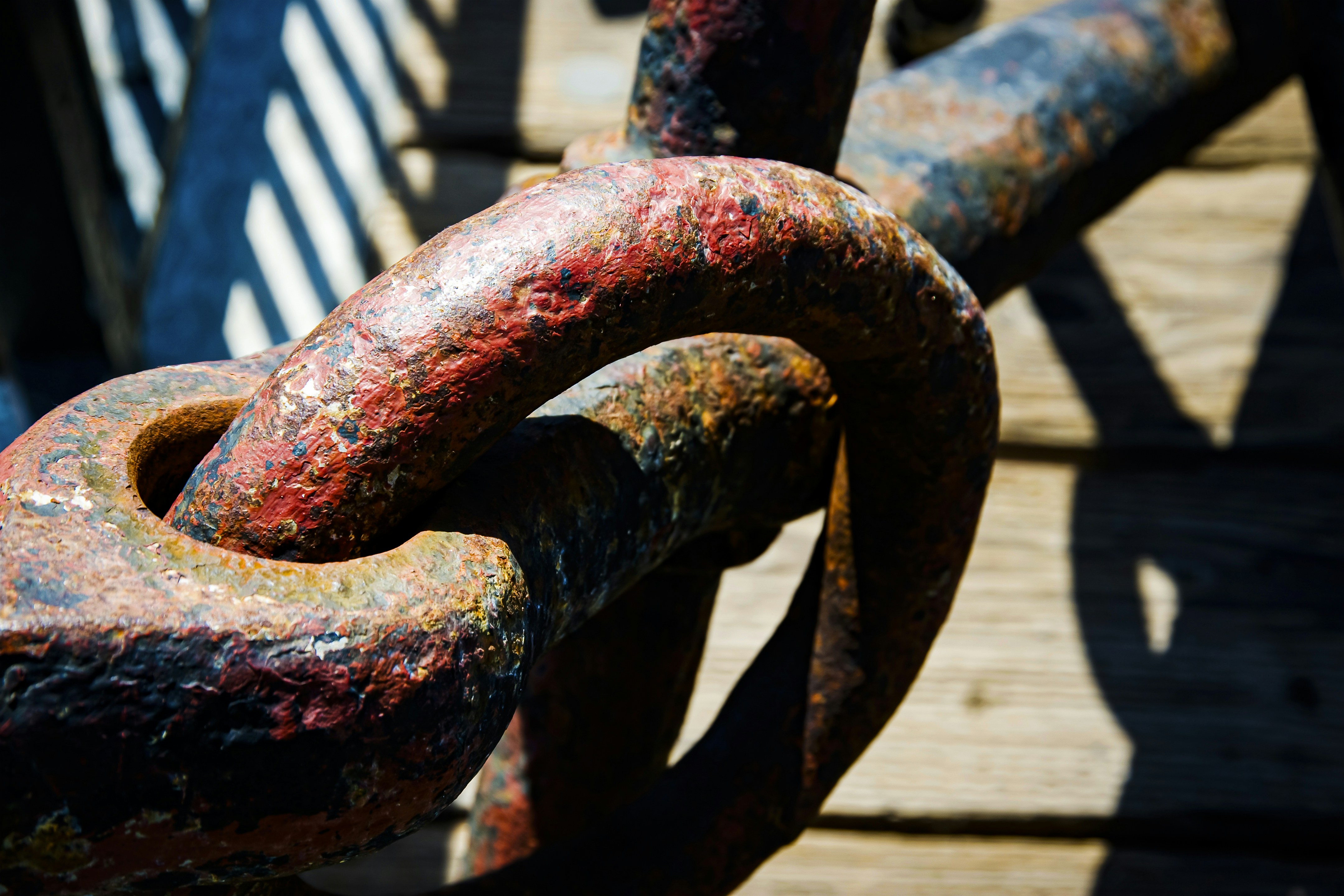 Rusted Chain Clasp: Weathered Texture and Sunlit Grit