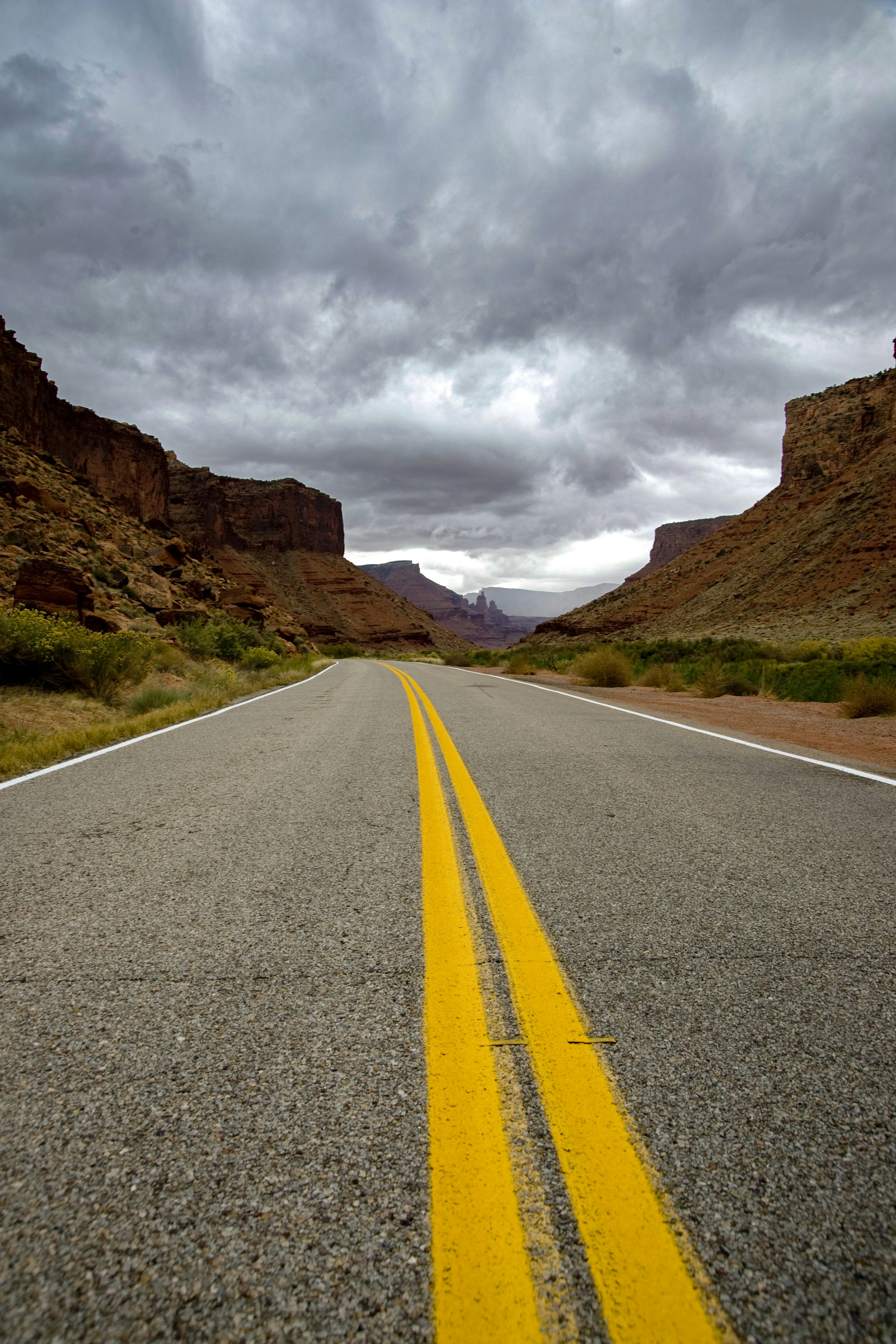 Desert Highway Convergence Under Stormy Skies