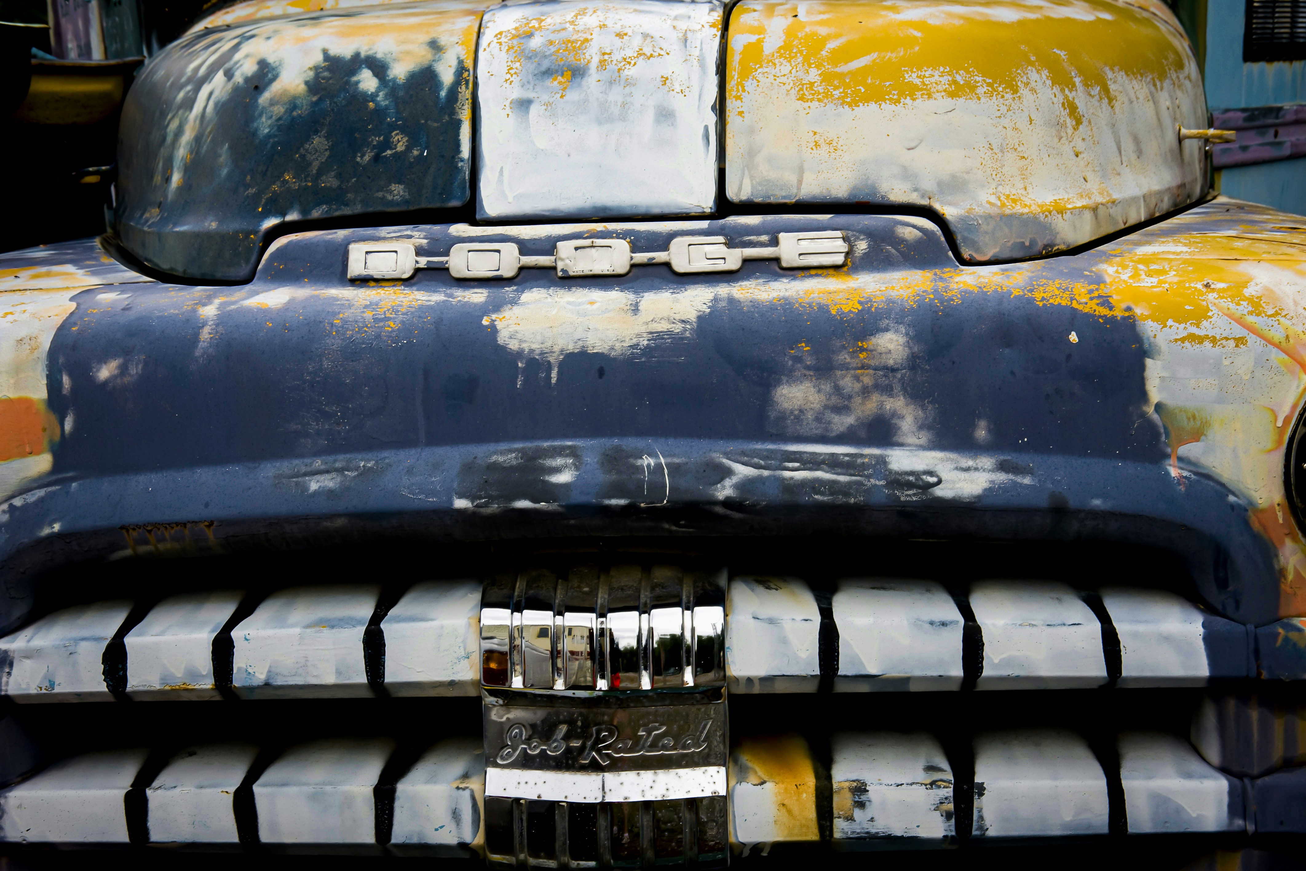 Weathered chrome Grin: The Cheeky Grille of a Faded Classic