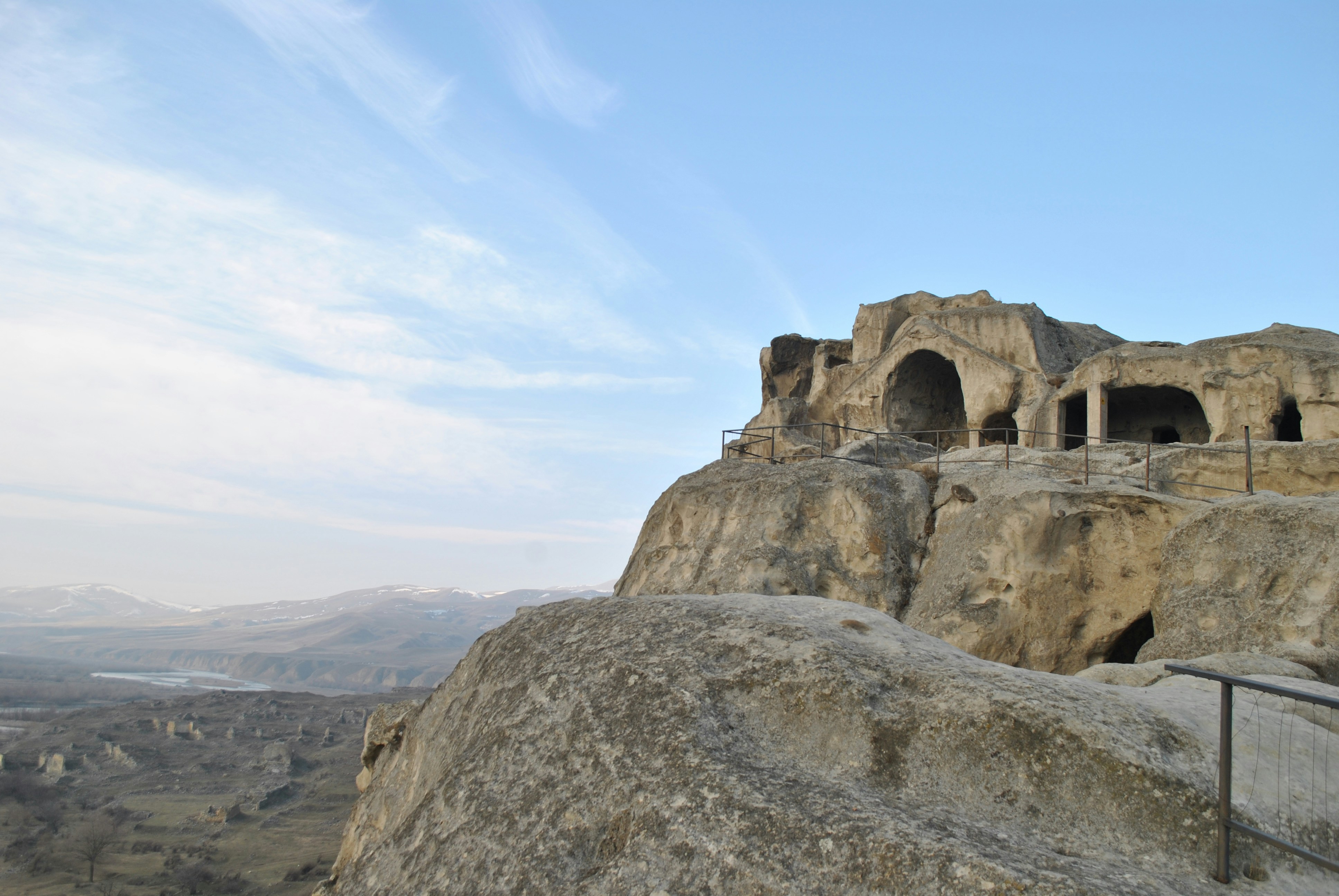 Ancient Caverns Overlooked by a Stone Terrace