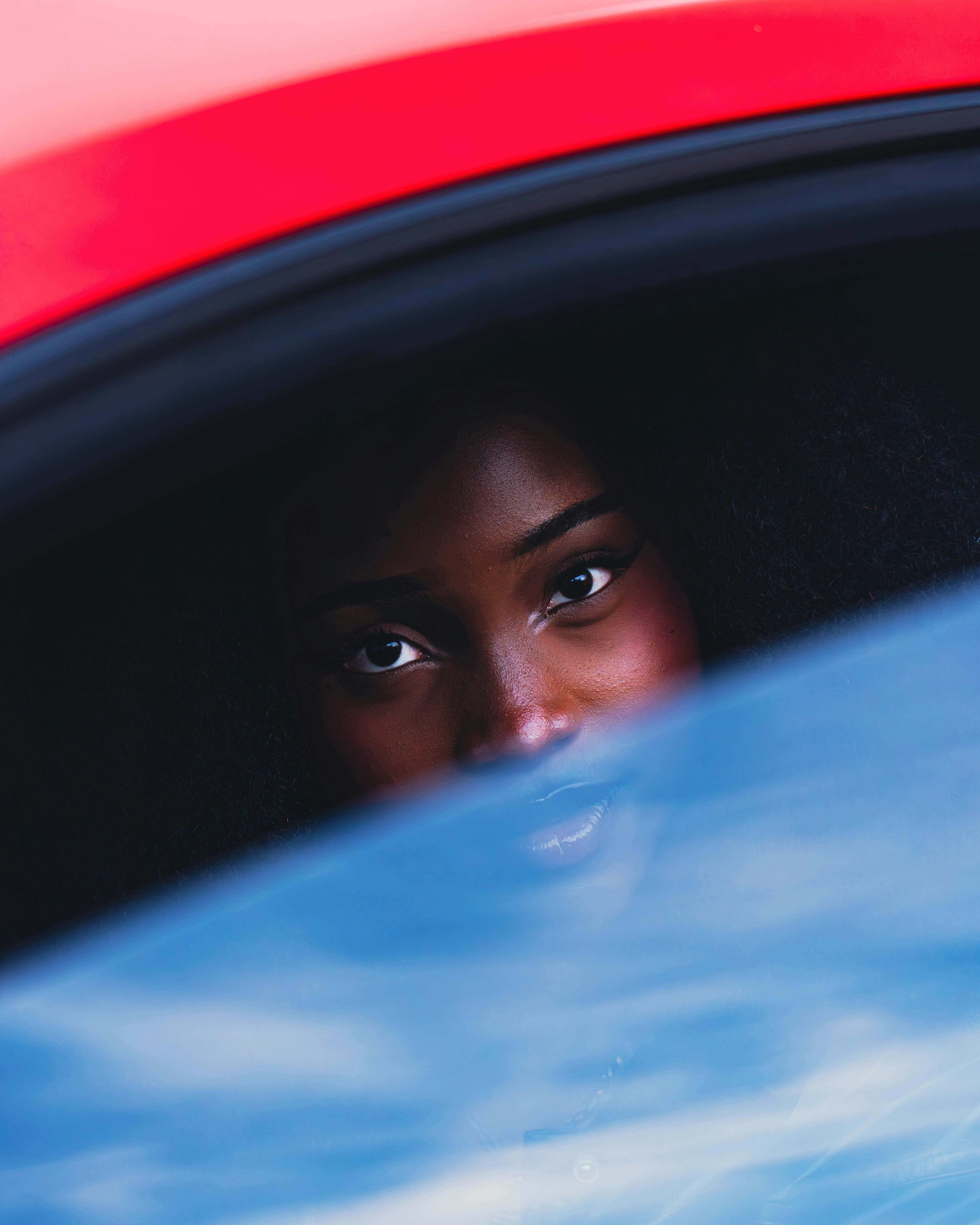 Eyes in the Window: A Glimpse Beyond the Carve of Red