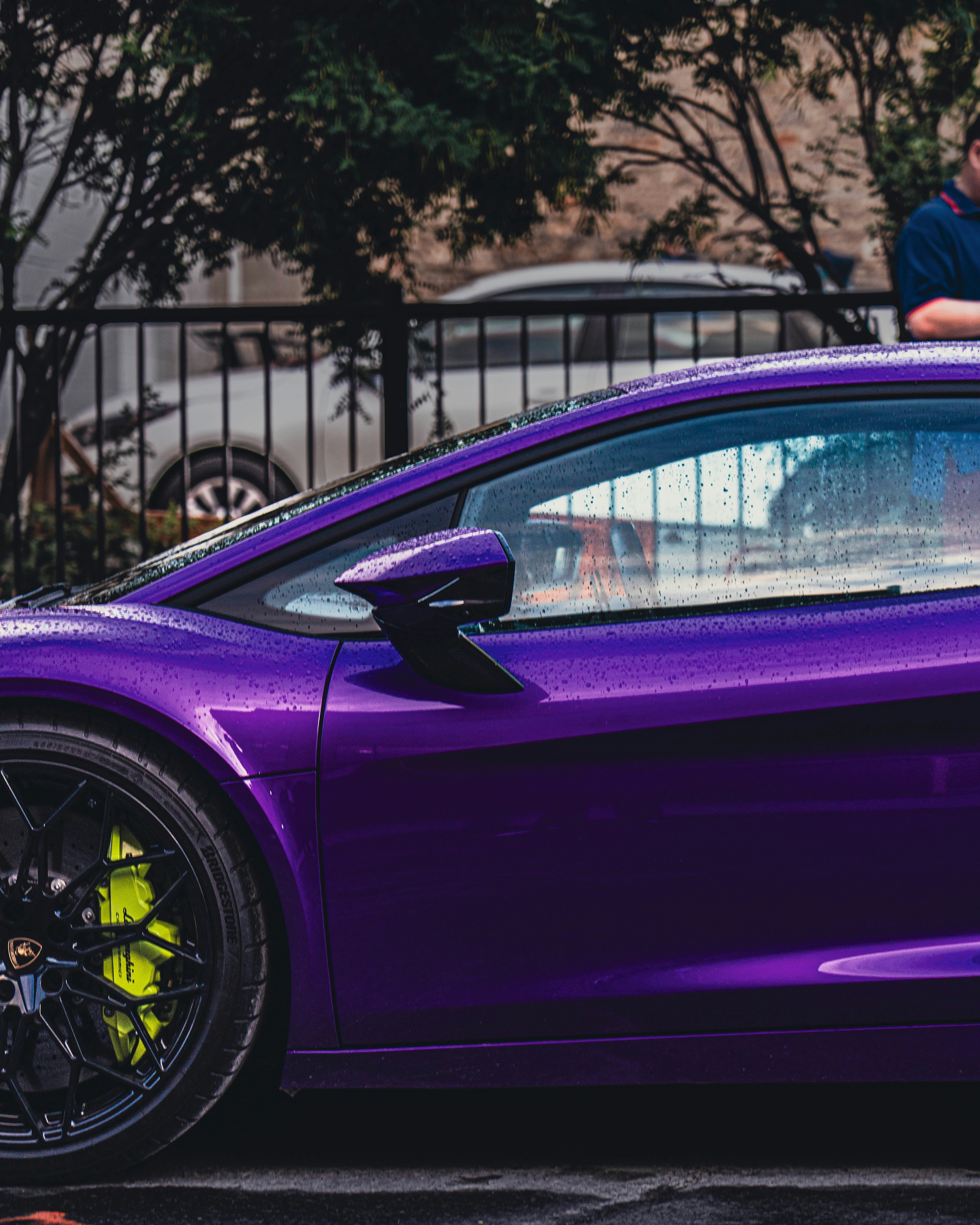 Violet Velocity: A Purple Porsche Resting Under Rain-kissed Glass