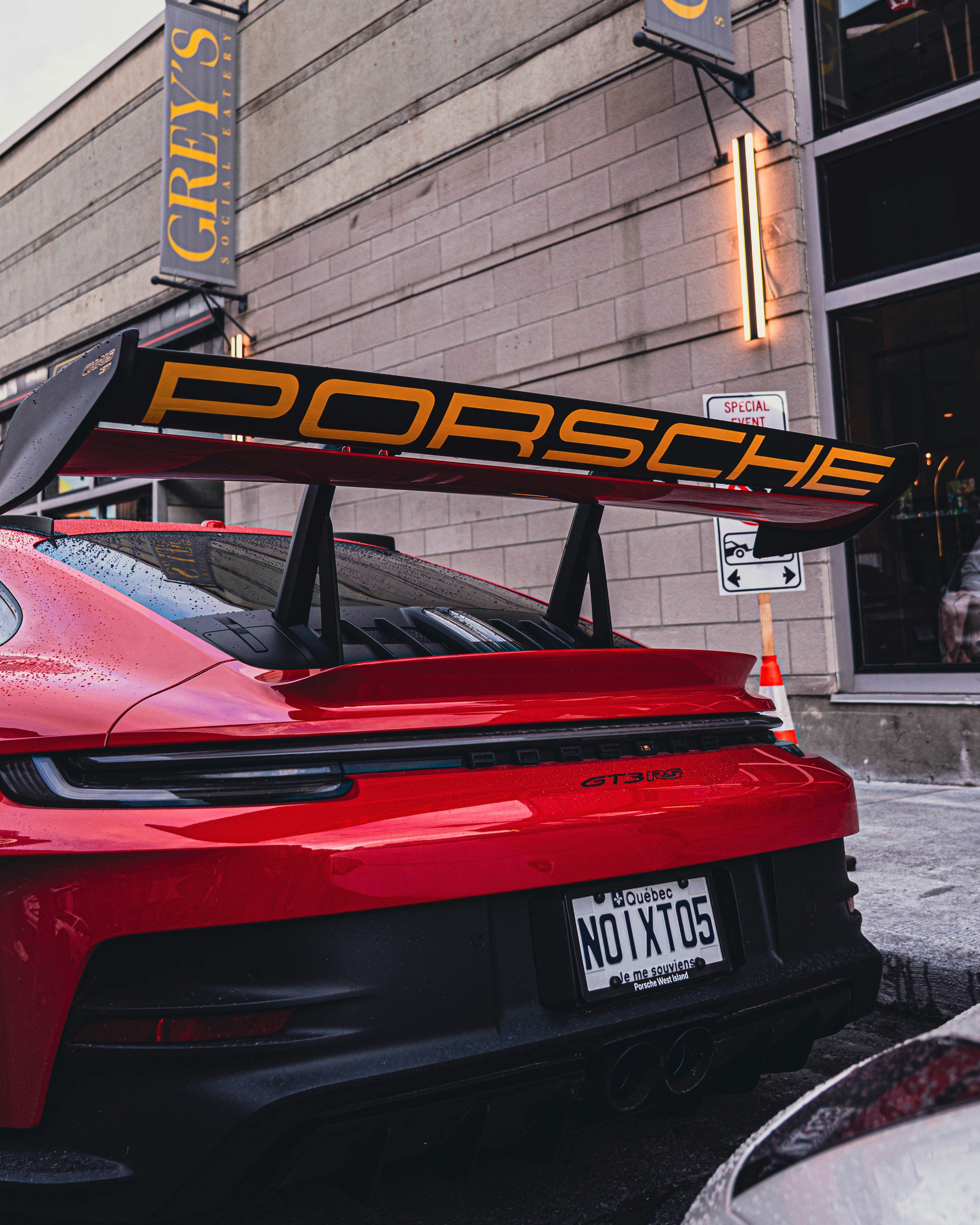 Rear Wing Dramatics: Red Porsche at the City Edge