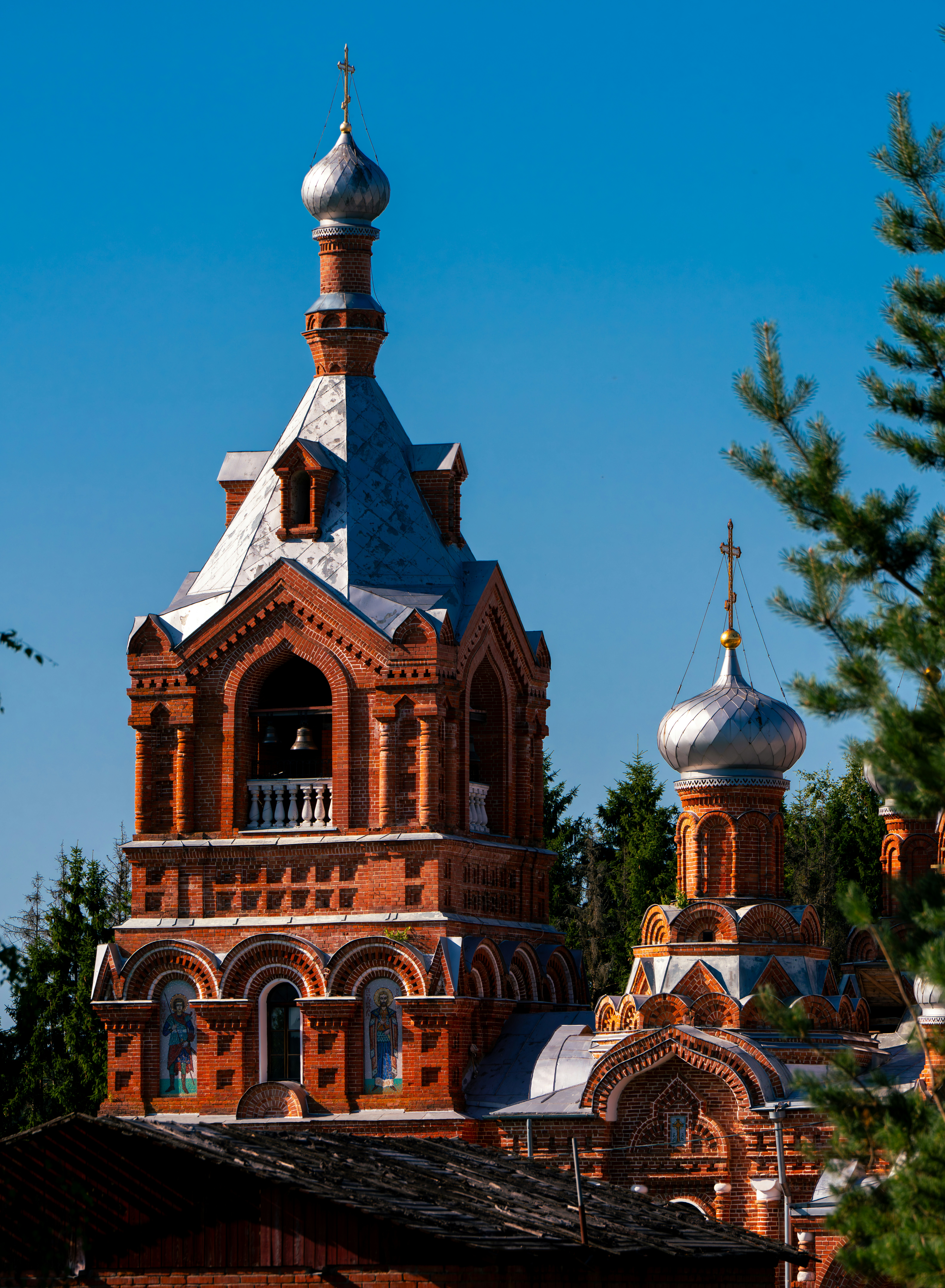 Brick Bell Tower with Onion Dome Under a Clear Blue Sky