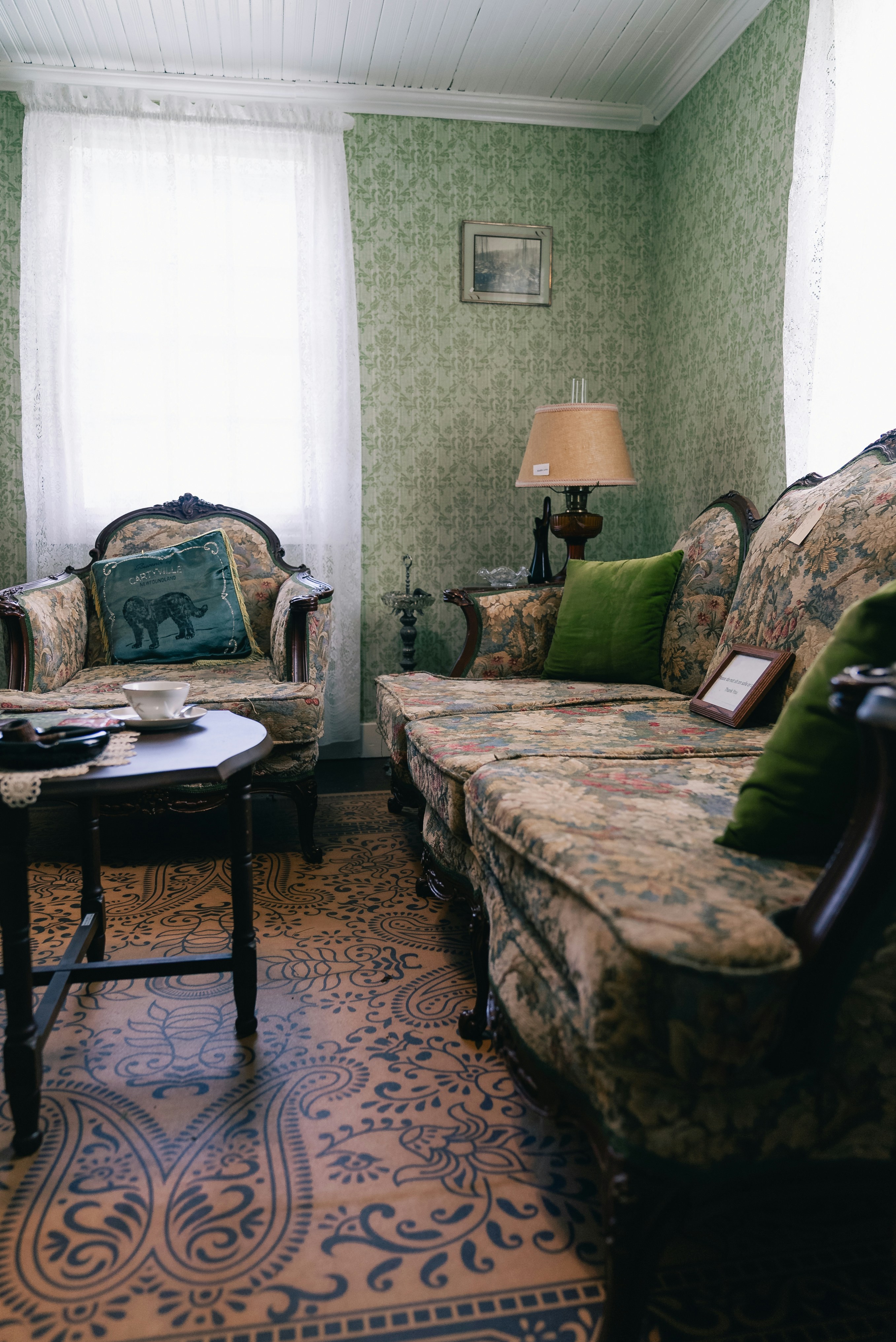 Vintage Living Room: Patterned Upholstery, Green Accents, and Quiet Afternoon Light