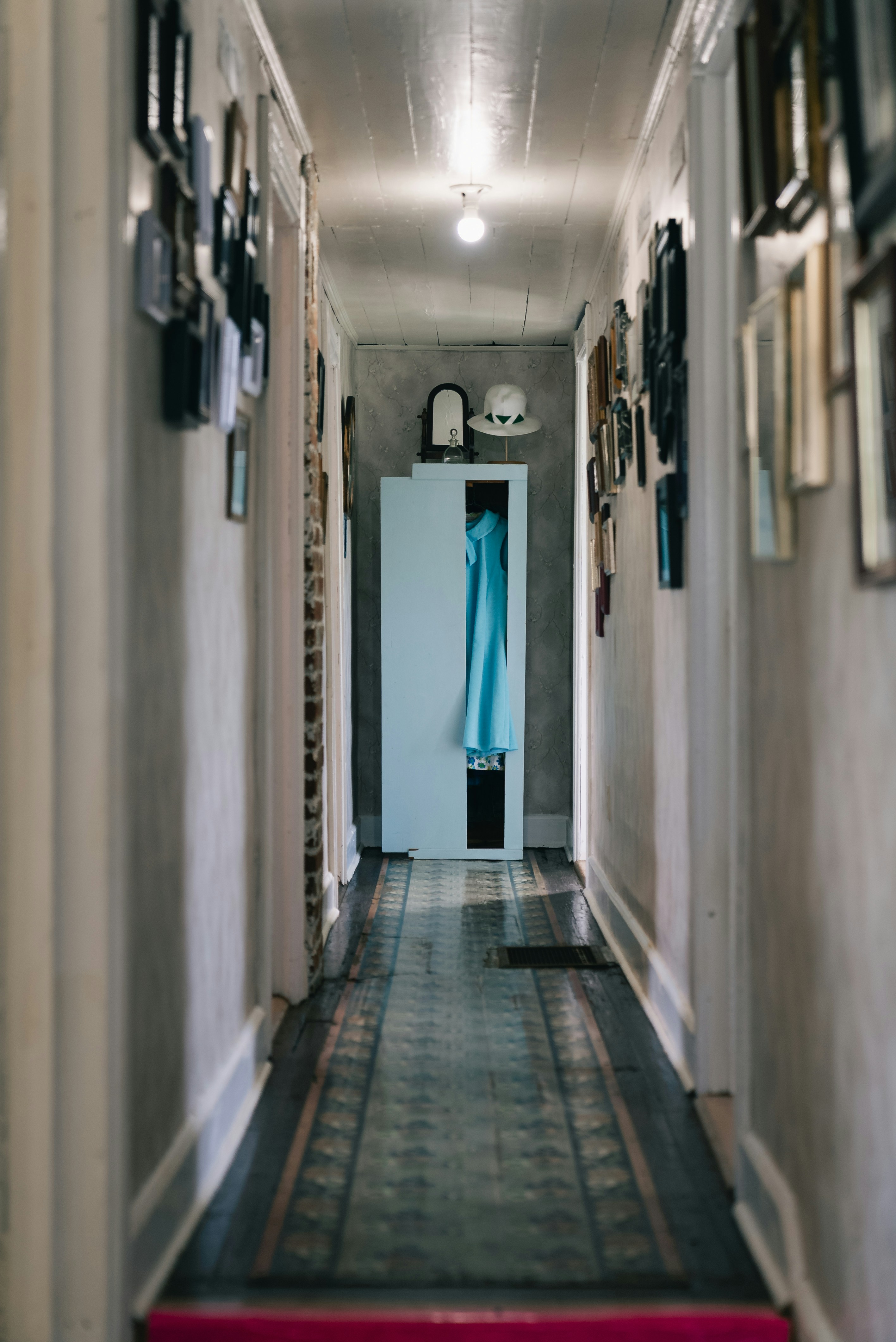 Blue Garment in Narrow Hallway Wardrobe