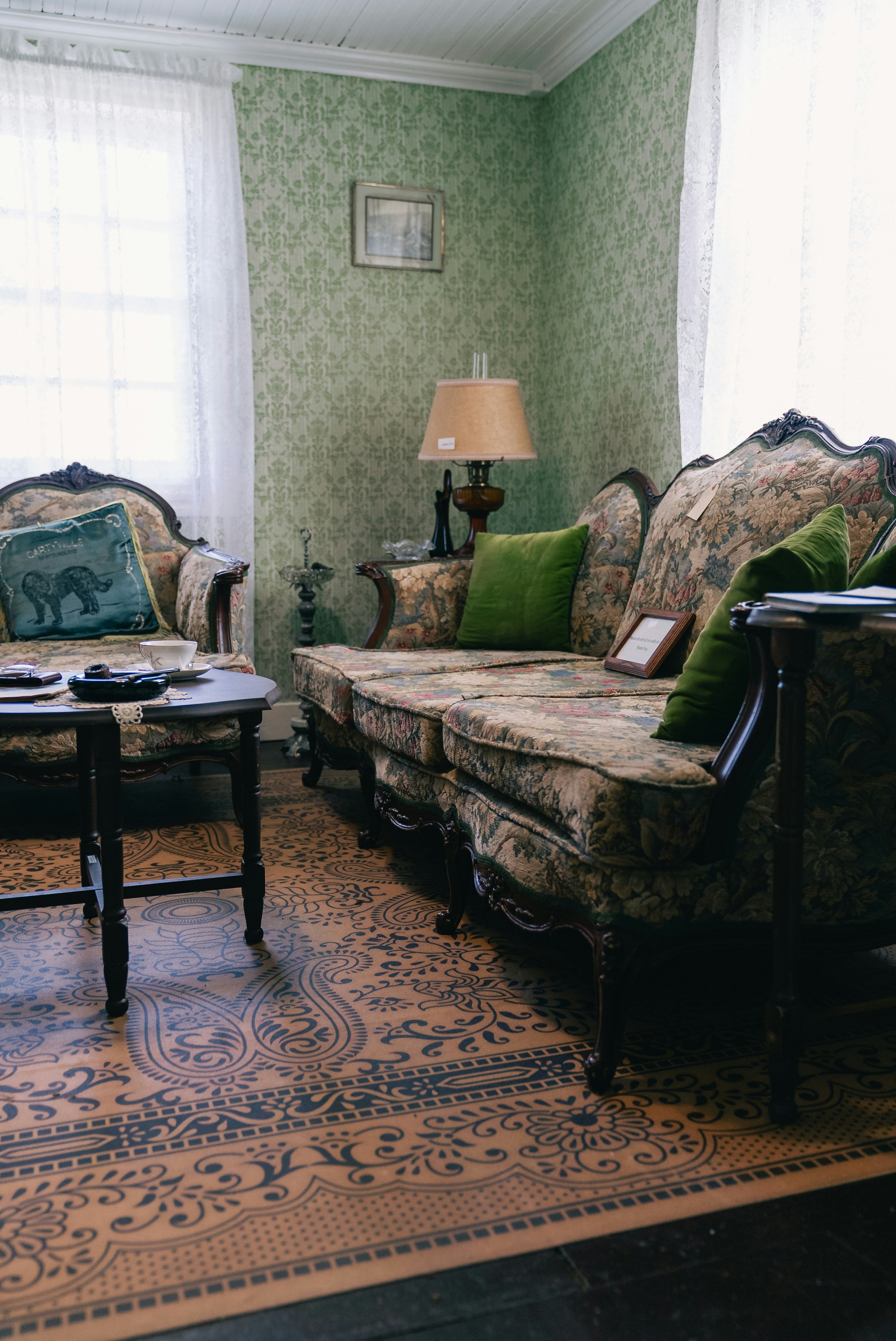 Vintage Parlor Reverie: Floral Upholstery and Quiet Corner of Green Wallpaper