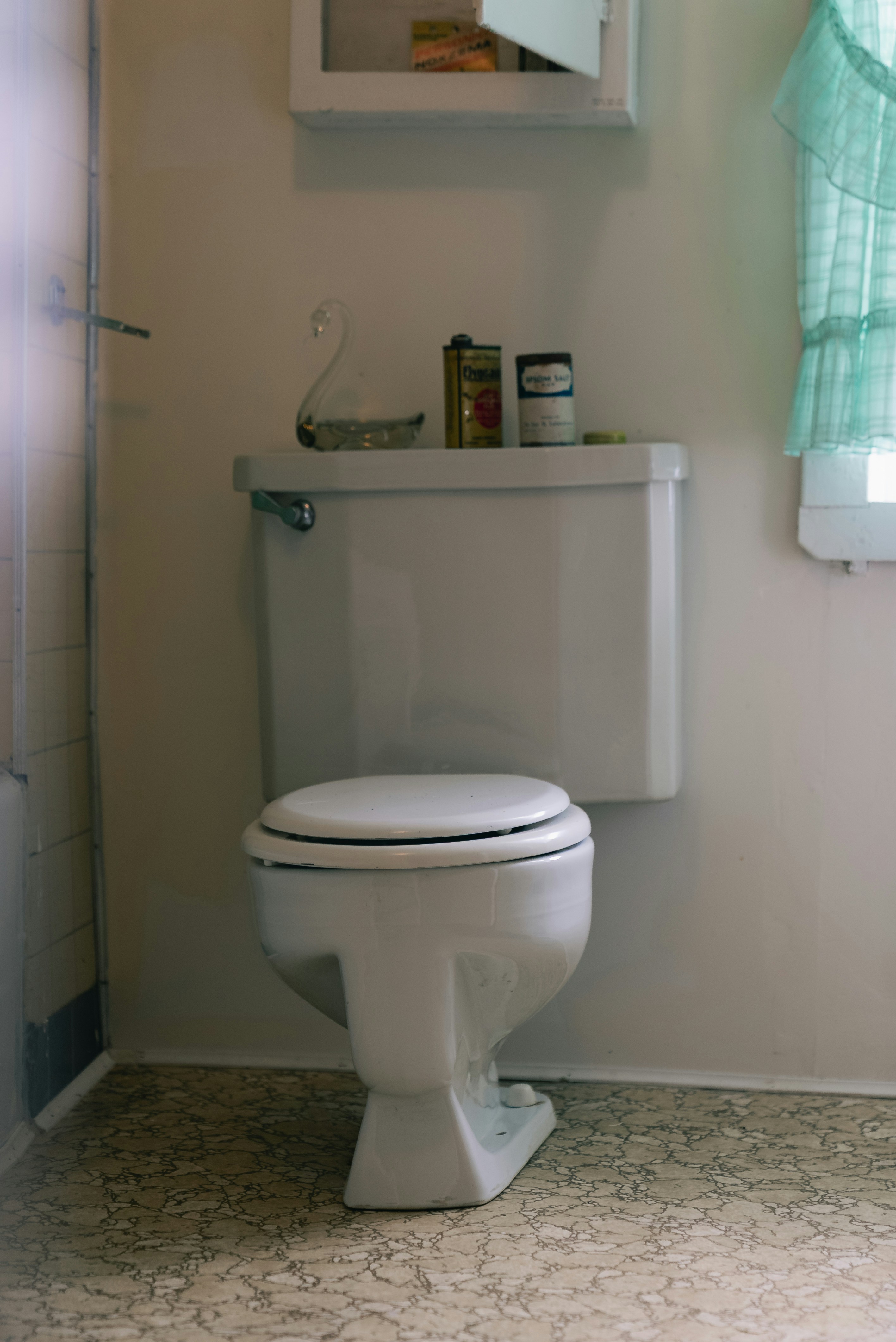 Quiet Bathroom Centerpiece: A Simple Toilet in Soft Light