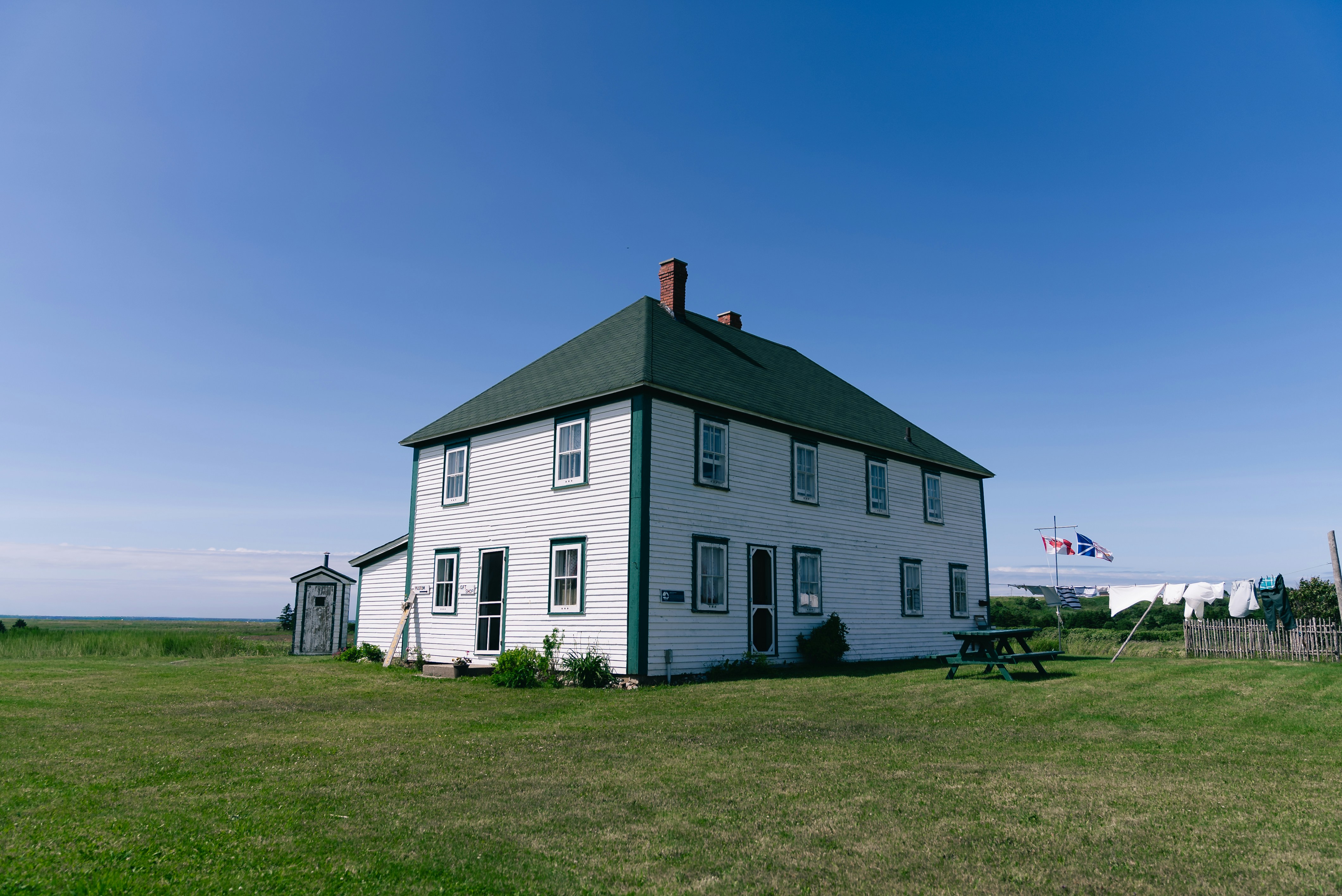 Coastal Homestead Under a Clear Seaside Sky