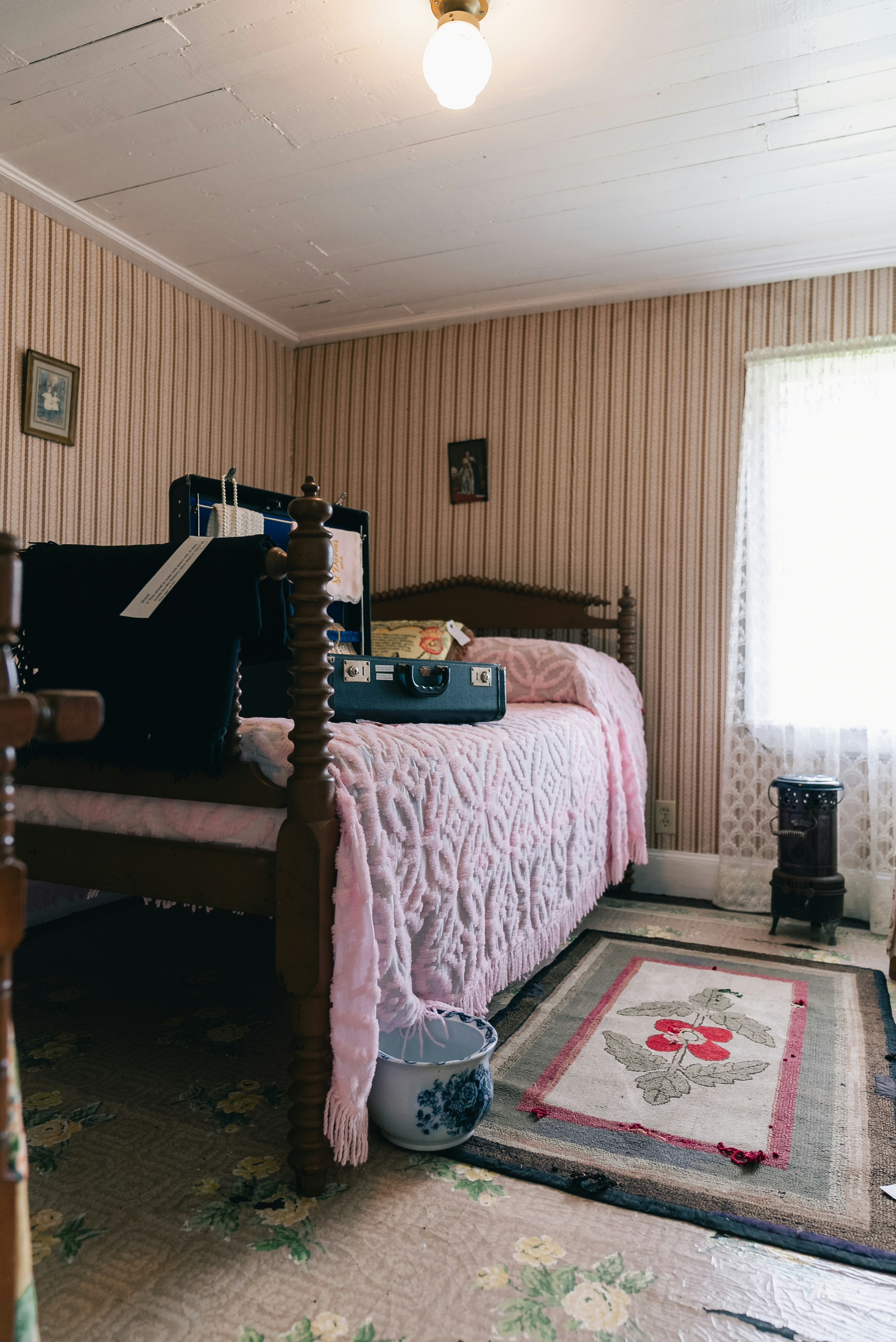 A Quiet Retreat: Pink Quilt and Vintage Treasures in Soft Evening Light
