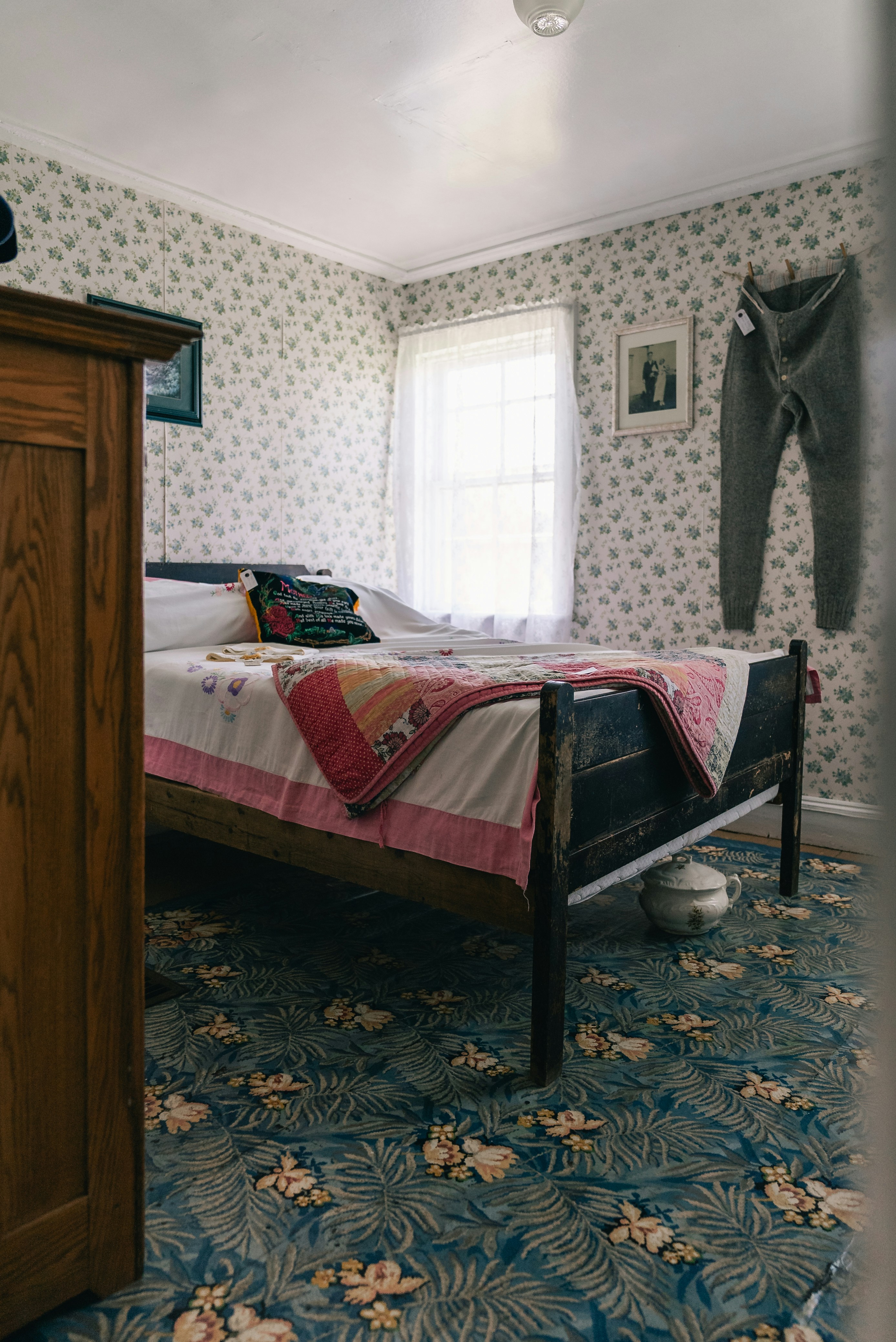 Quiet Sleep: A Vintage Bedroom with Floral Clutter and Soft Morning Light