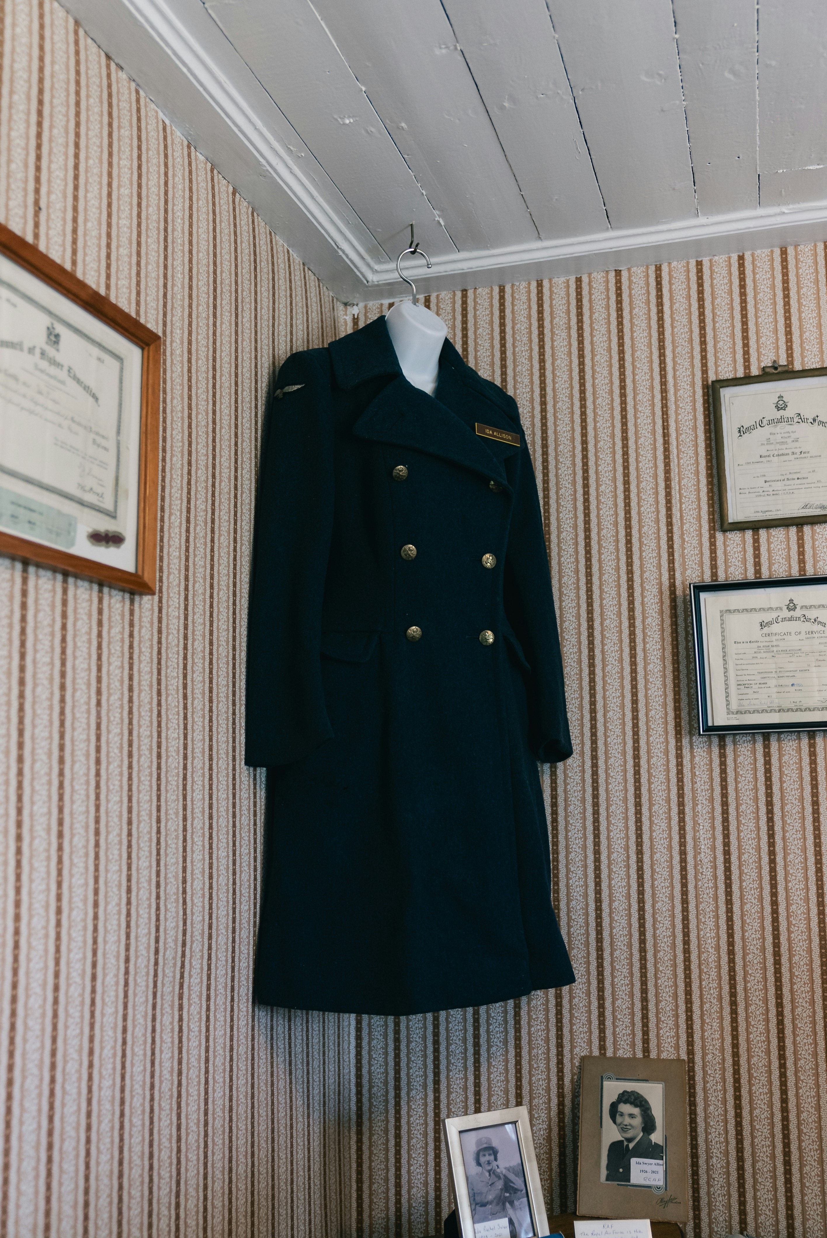 Uniform Reverie: A Dress Uniform Hangs in a Heritage Room