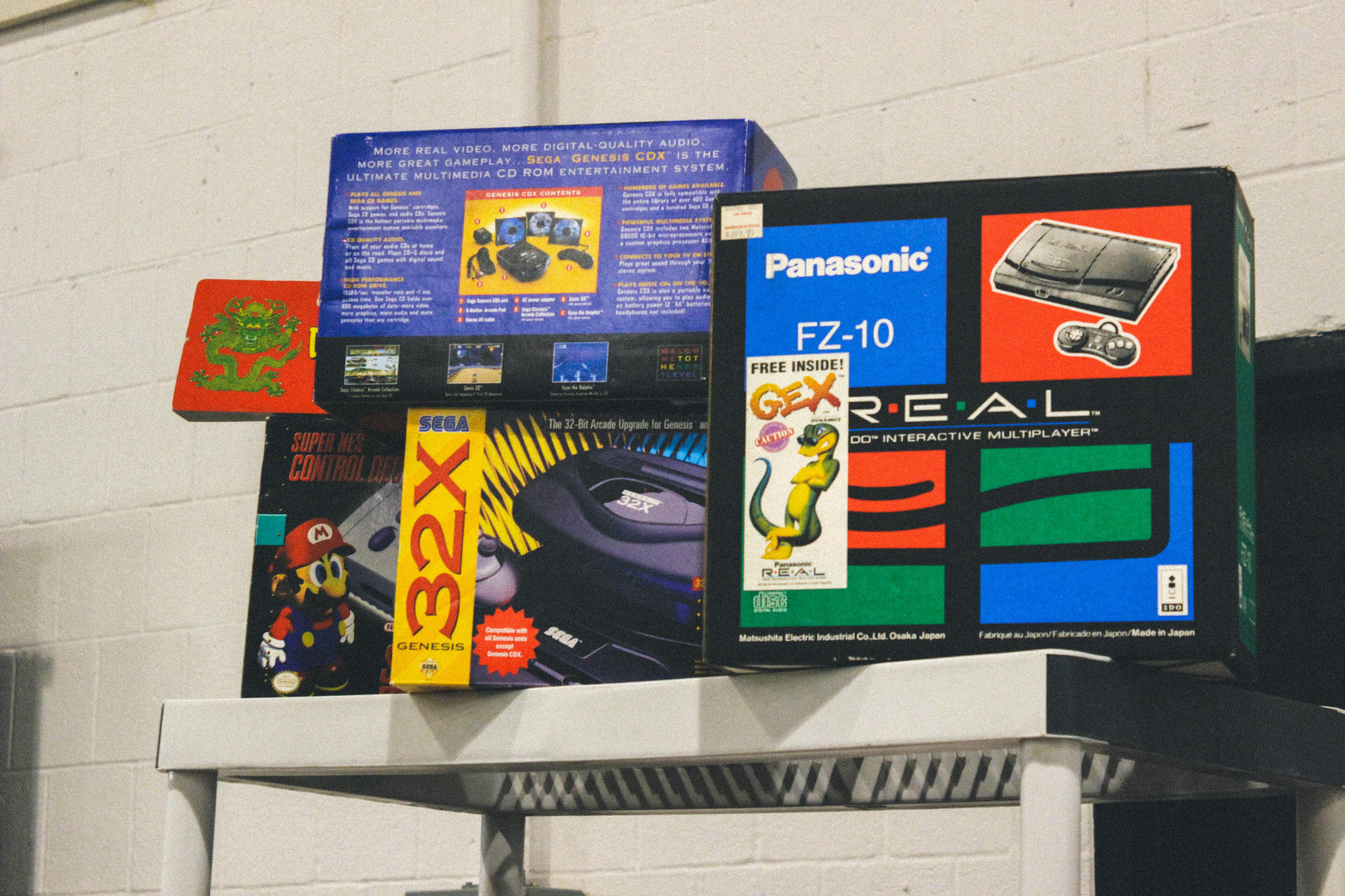 Retro Console Boxes on a Public Shelf