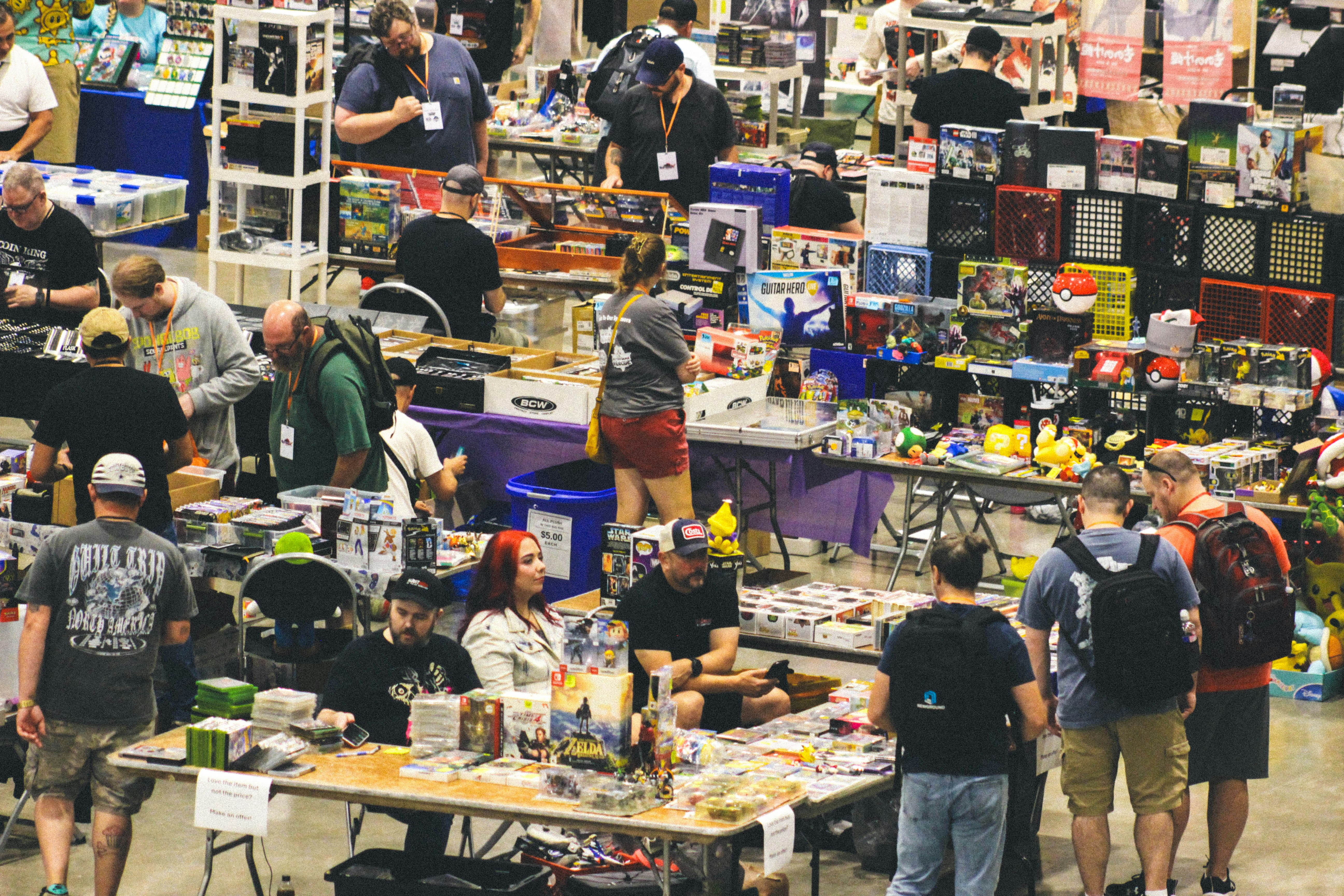 Bustling Convention Floor: A Cornucopia of Collectibles and Curious Faces