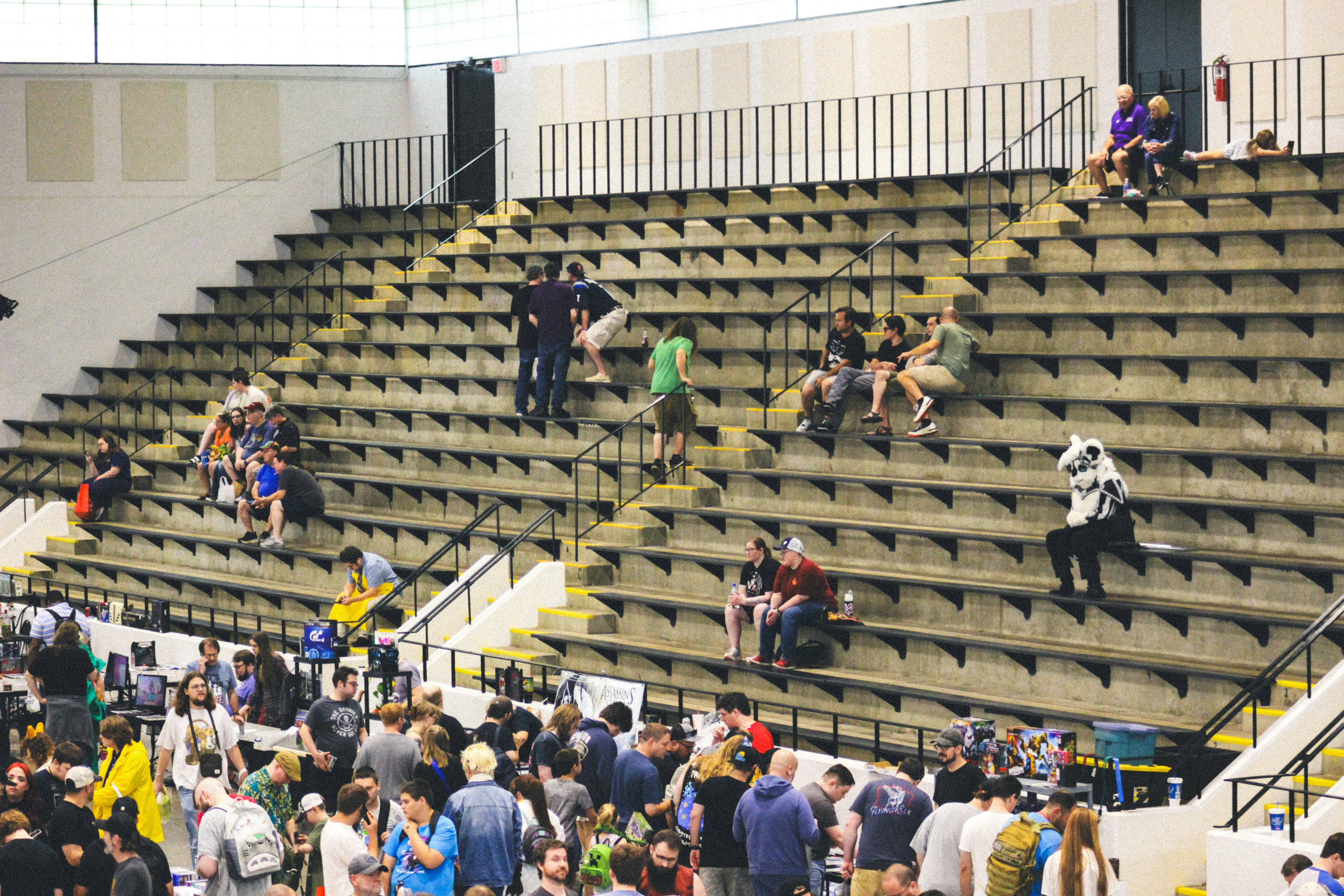 Tangled Crowd Above the Quiet Mid-Tier Seats
